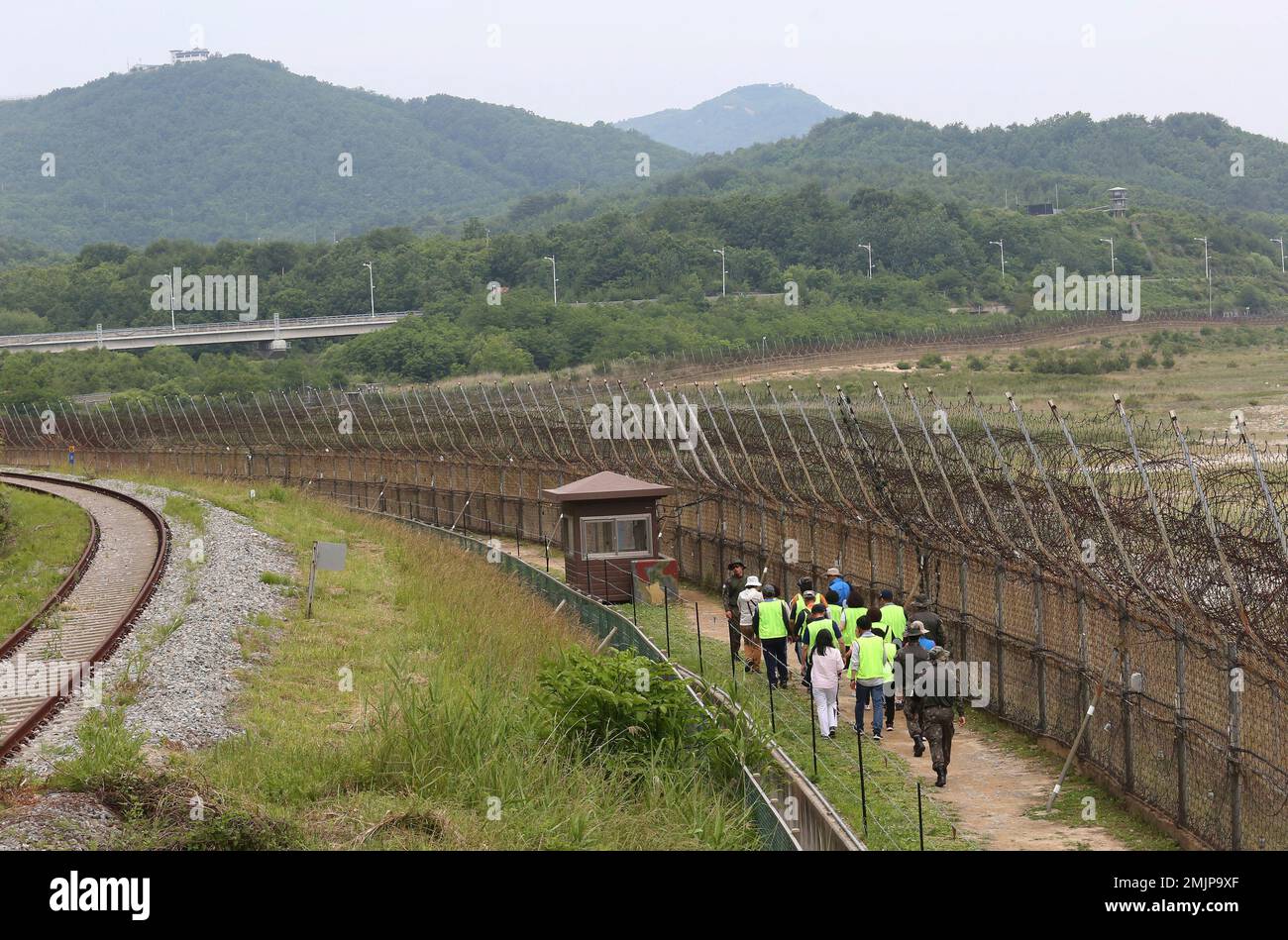 Hikers walk along the DMZ Peace Trail in the demilitarized zone in ...