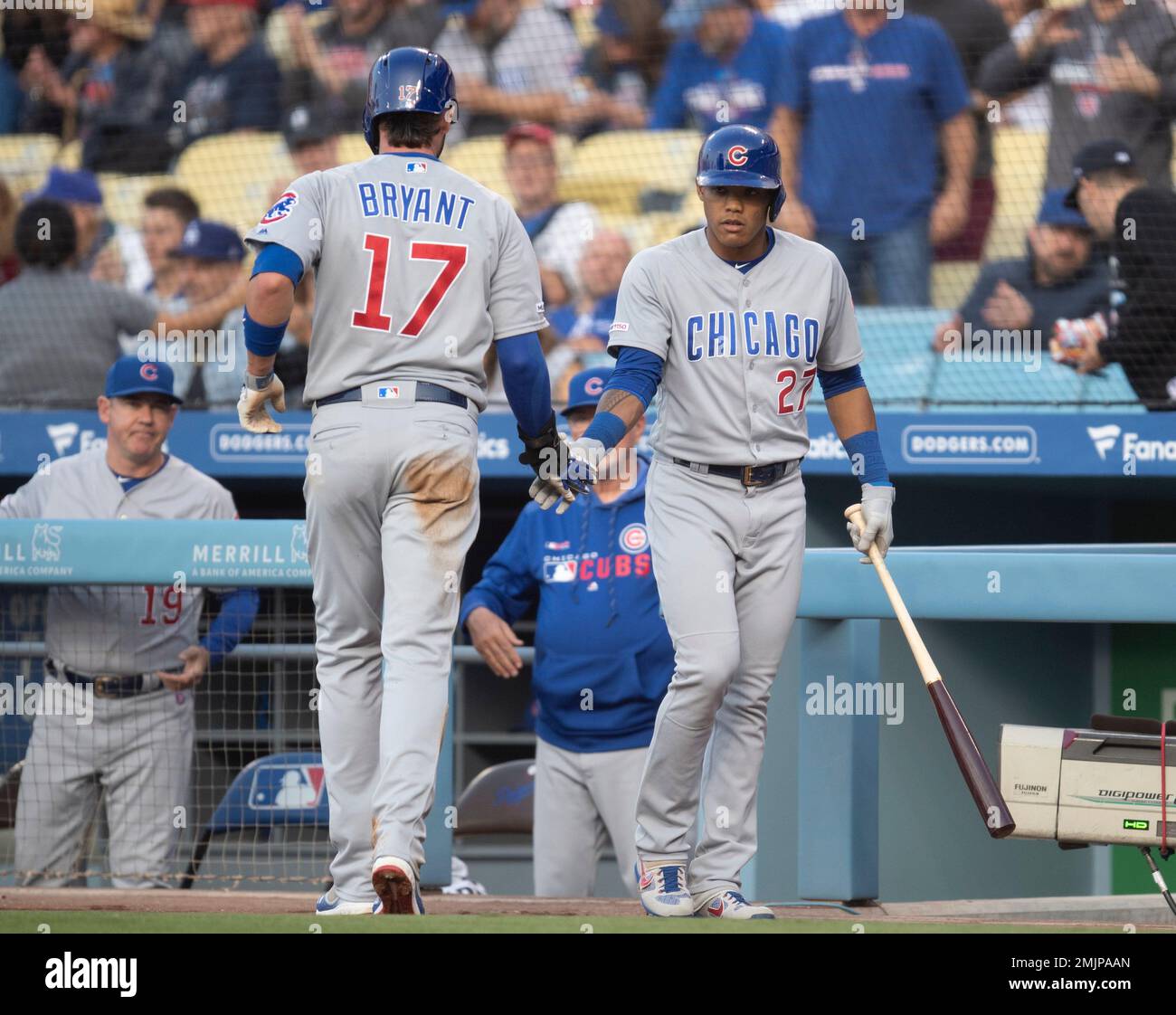 Chicago Cubs' Addison Russell, right greets Kris Bryant after Bryant ...