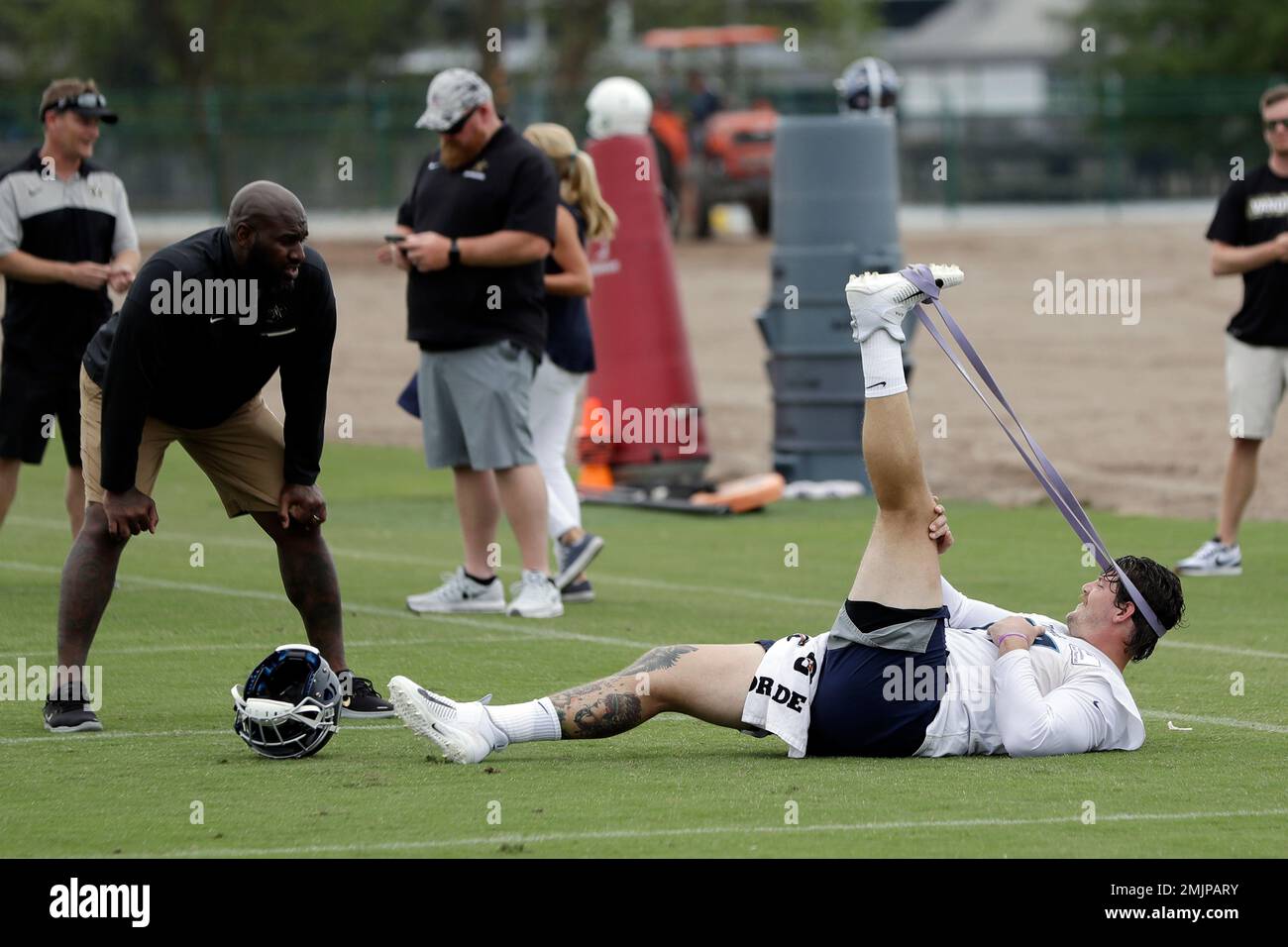 Tennessee Titans offensive tackle Taylor Lewan stretches after an ...