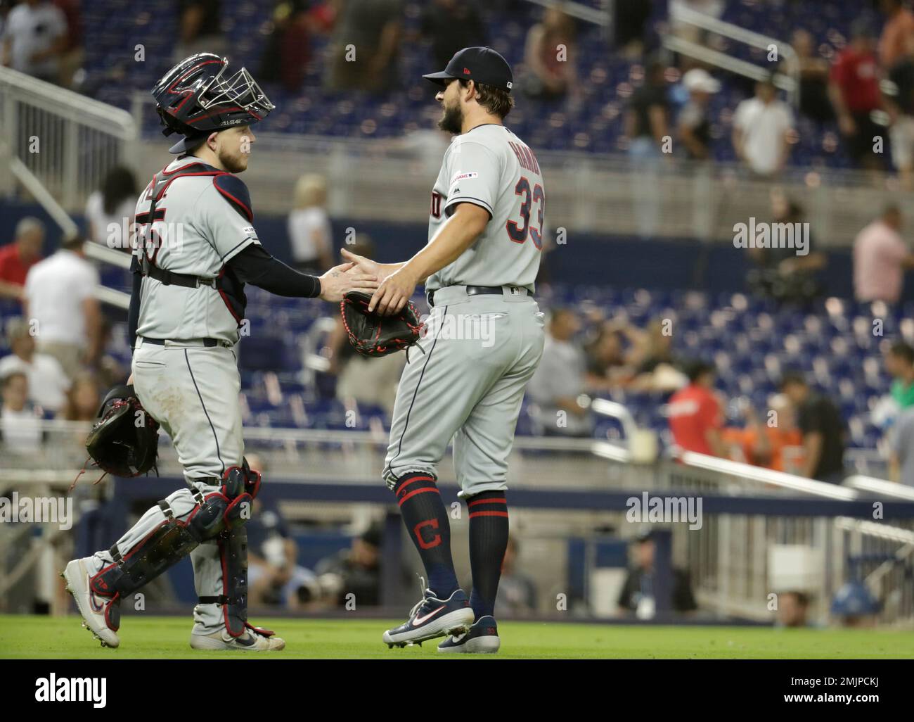 Cleveland Indians catcher Roberto Perez, left, shakes hands with relief ...