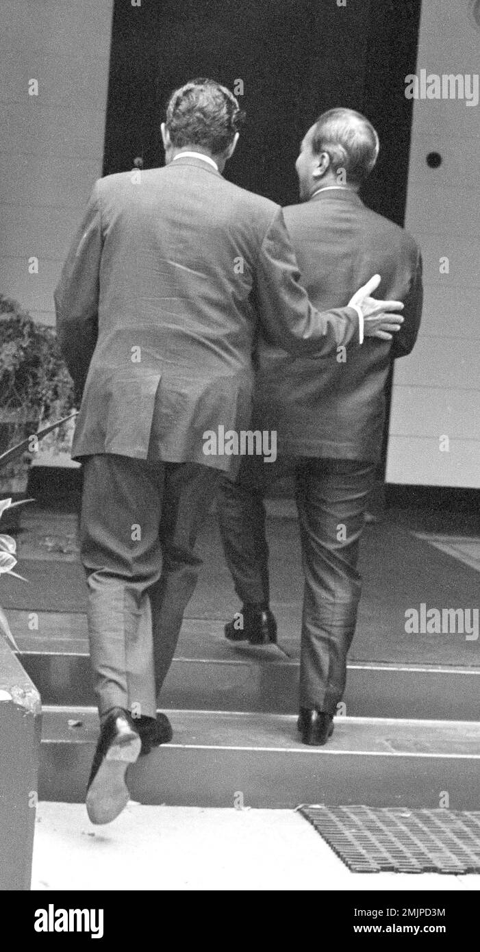 President Richard Nixon puts a hand on the back of President Nguyen Van ...