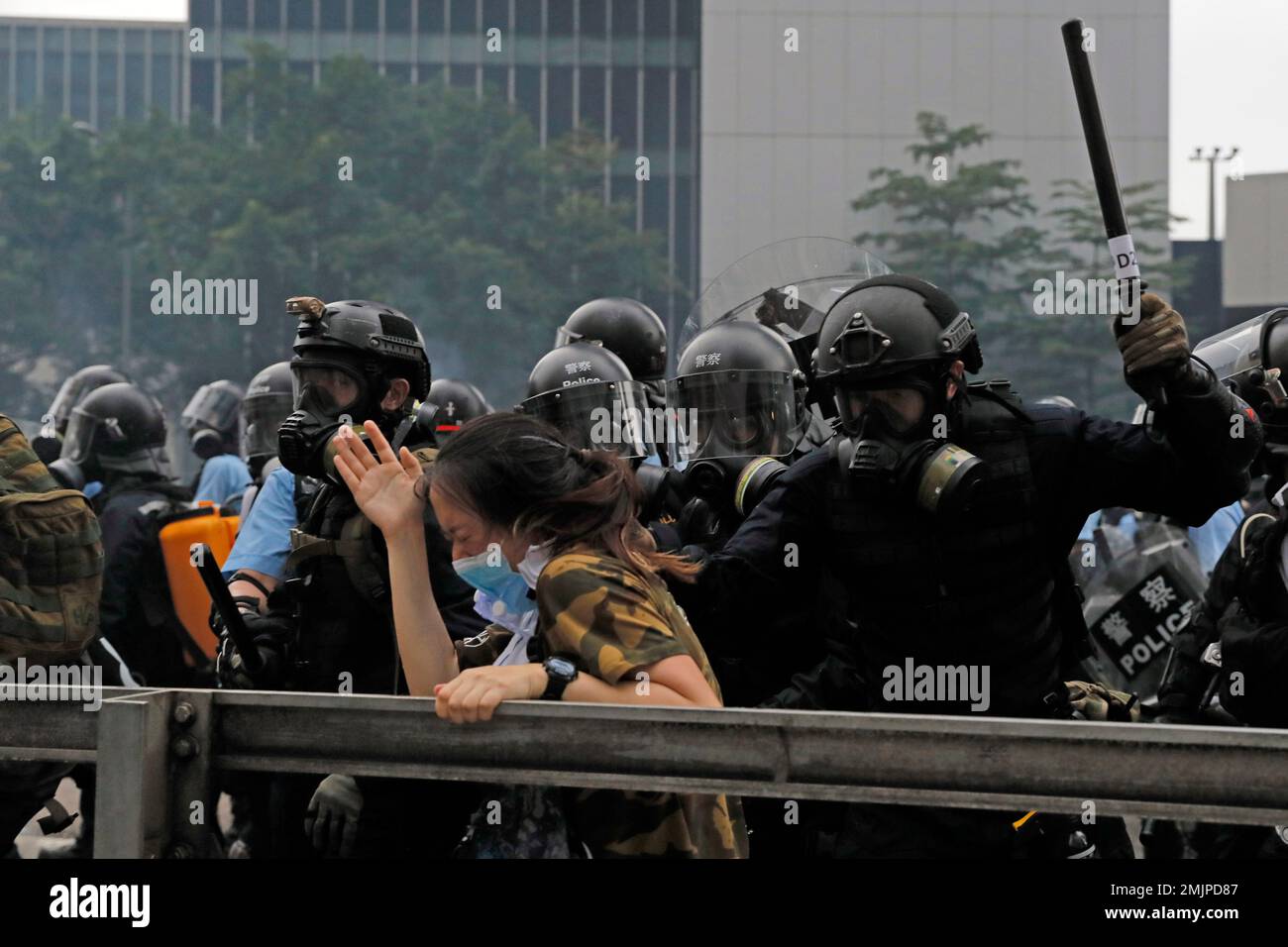 In this photo taken on Wednesday, June 12, 2019,a protester reacts as ...