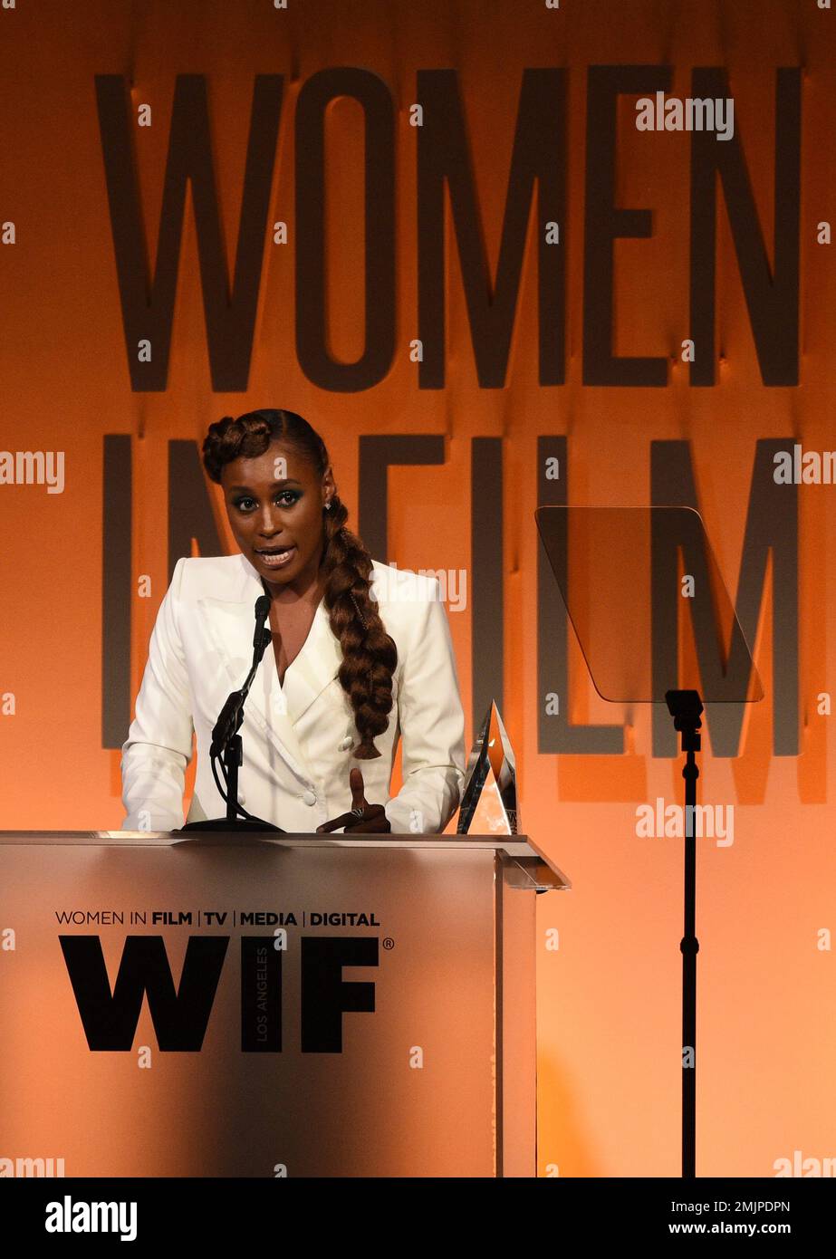 Issa Rae accepts the women in film emerging entrepreneur award at the ...