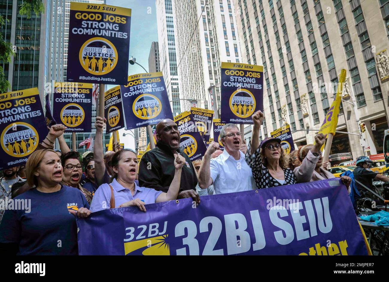 Supporters of the 32BJ SEIU commercial office cleaners union march ...