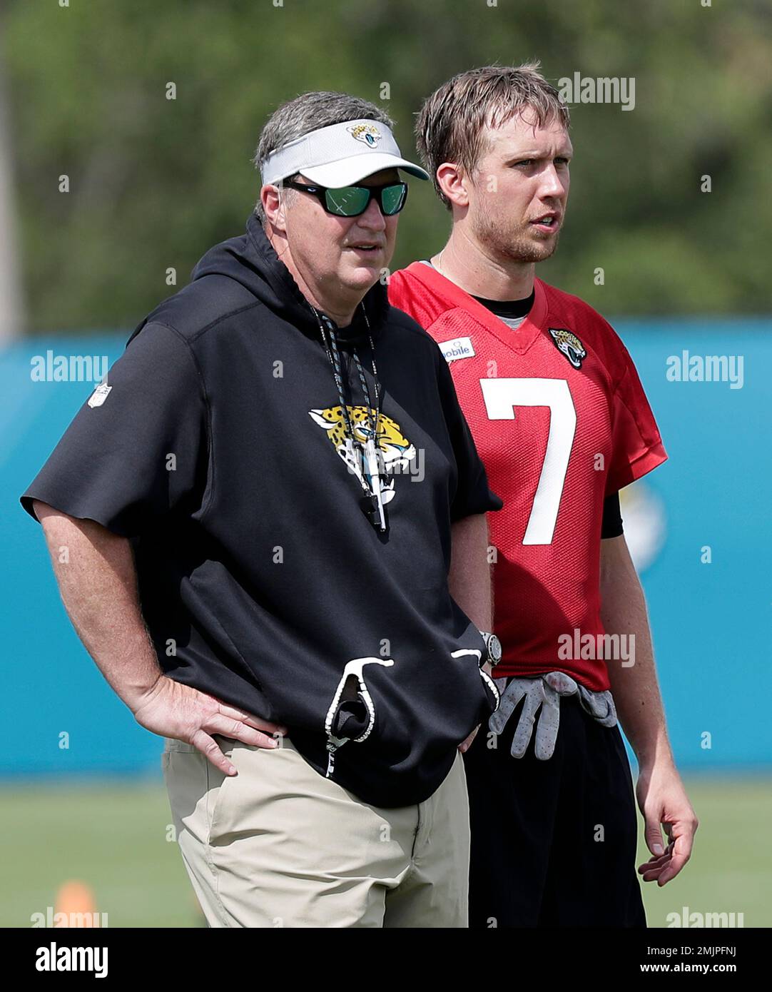 Jacksonville Jaguars head coach Doug Marrone, left, talks with ...