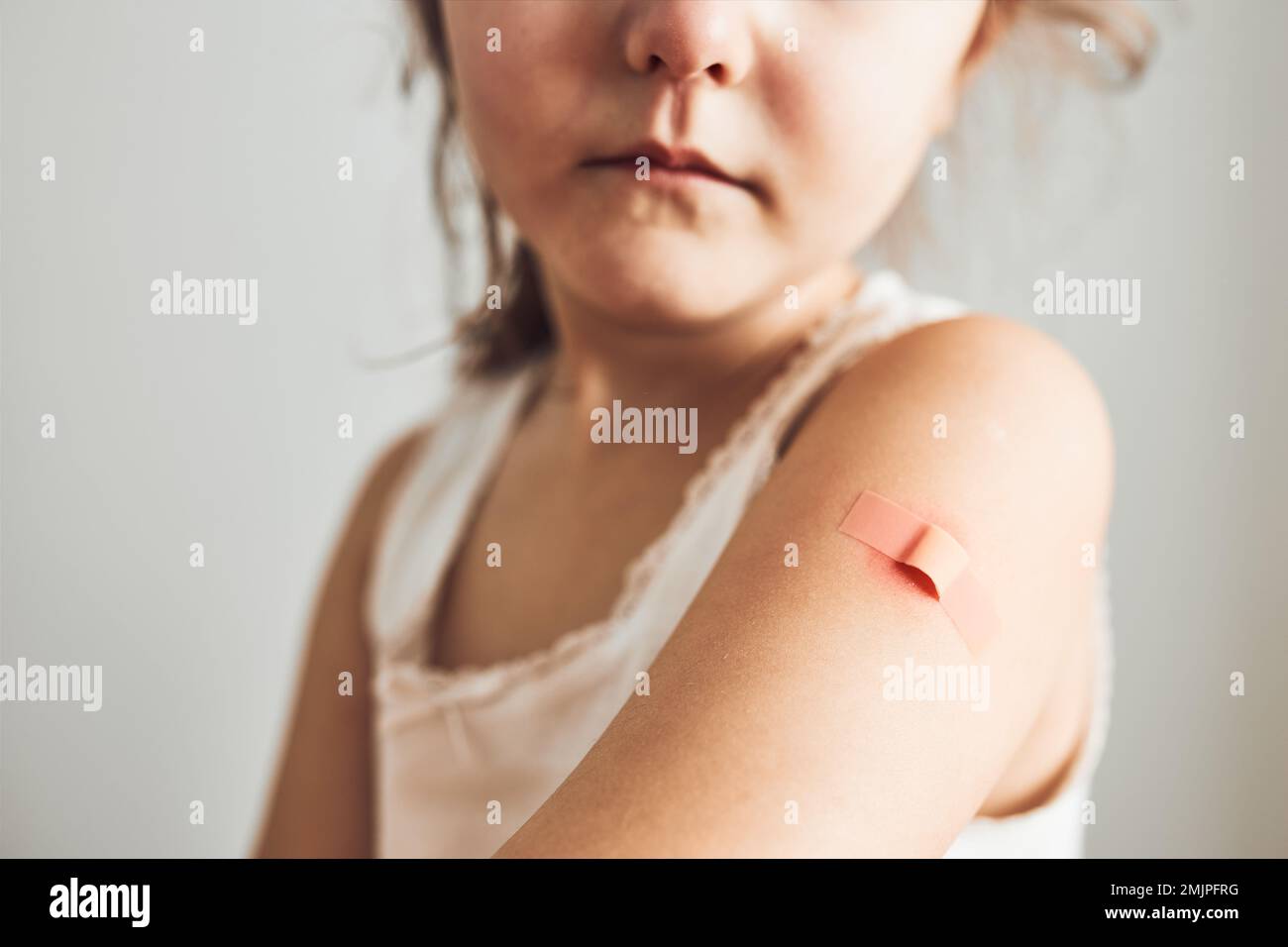 Little girl feeling pain having some side effects after vaccination ...