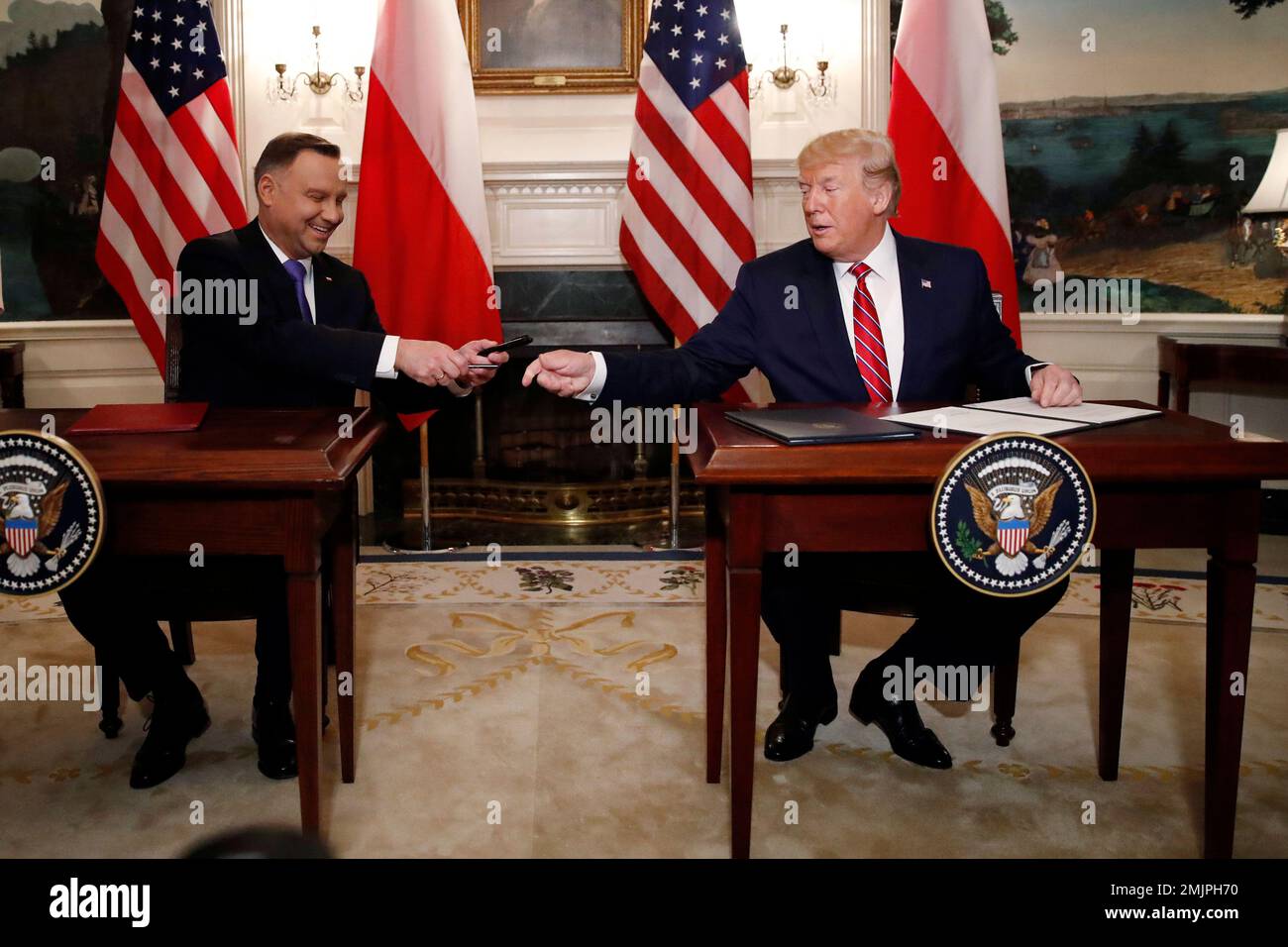 President Donald Trump and Polish President Andrzej Duda exchange pens ...