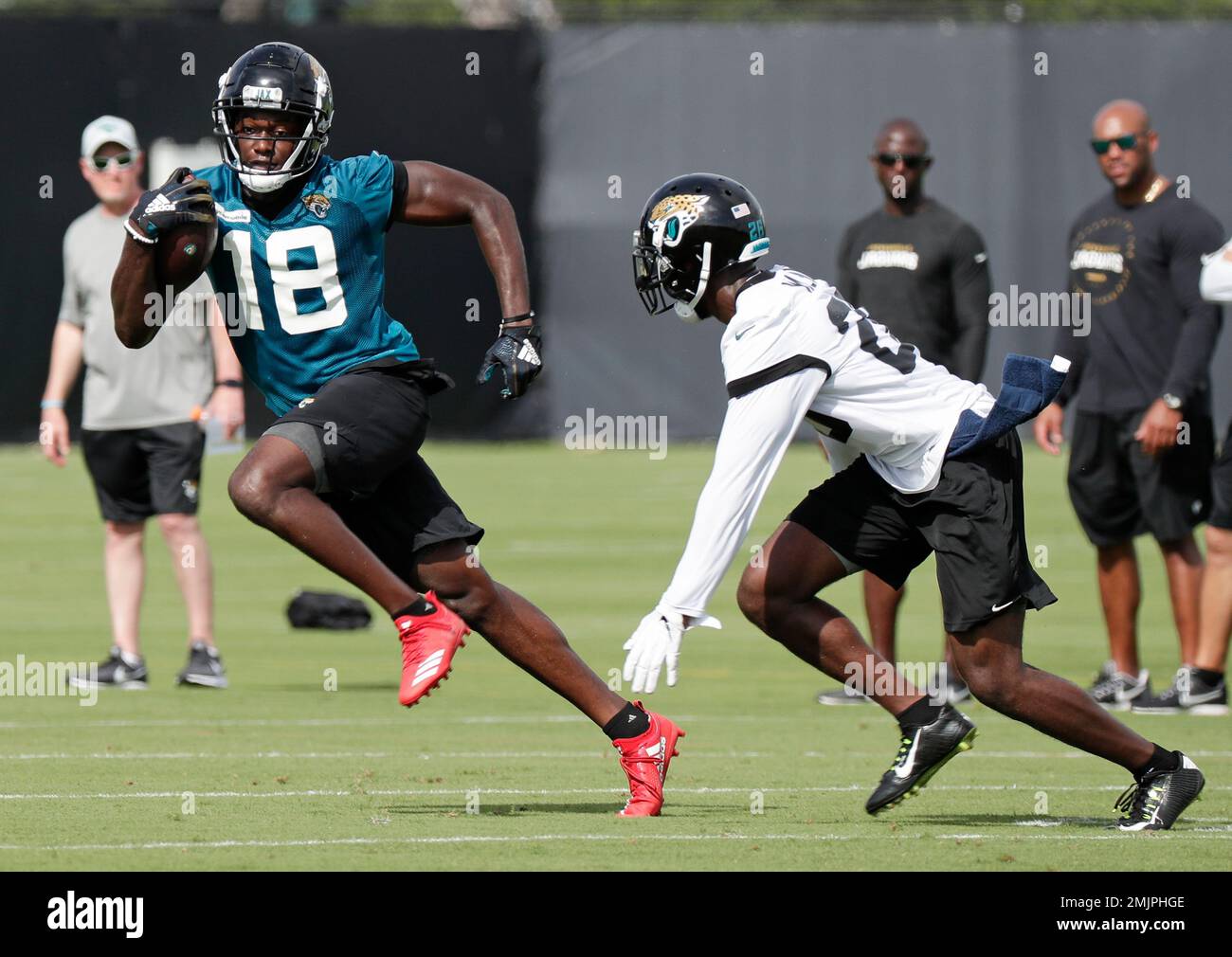 Jacksonville Jaguars wide receiver Chris Conley (18) tries to evade ...