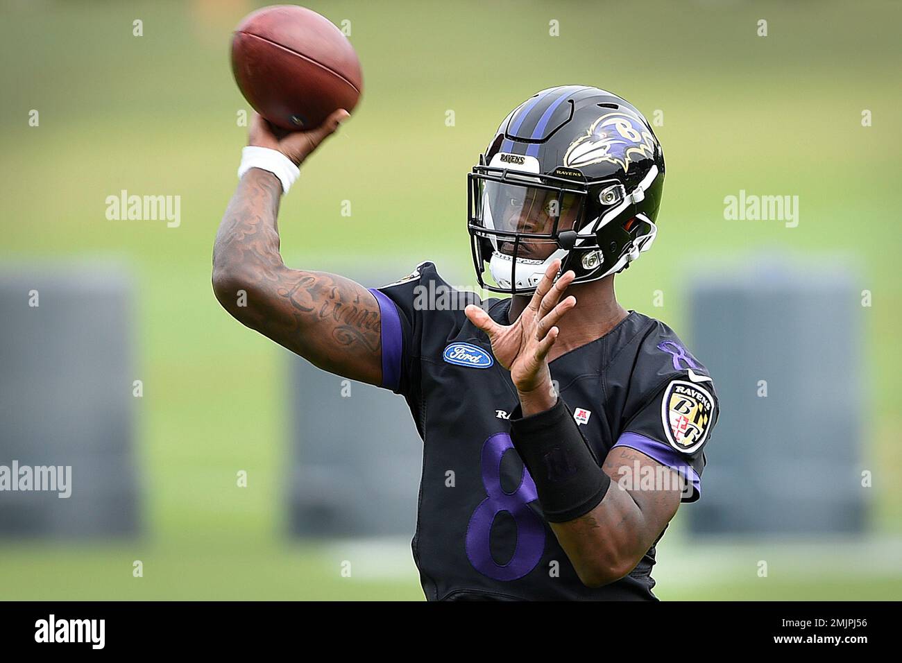 Baltimore Ravens quarterback Lamar Jackson throws a pass at the team's ...