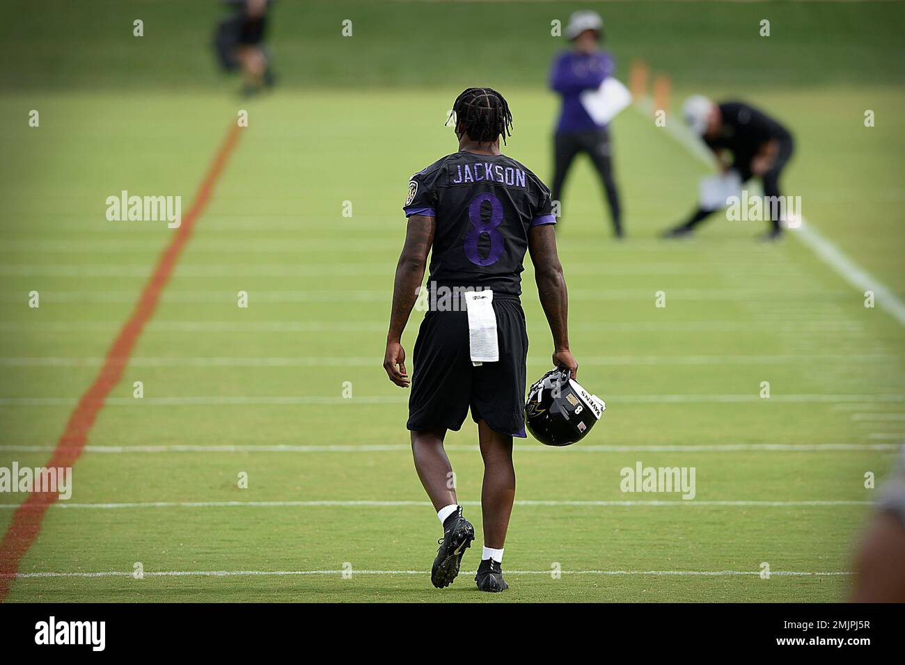 Baltimore Ravens quarterback Lamar Jackson takes the field at the team ...