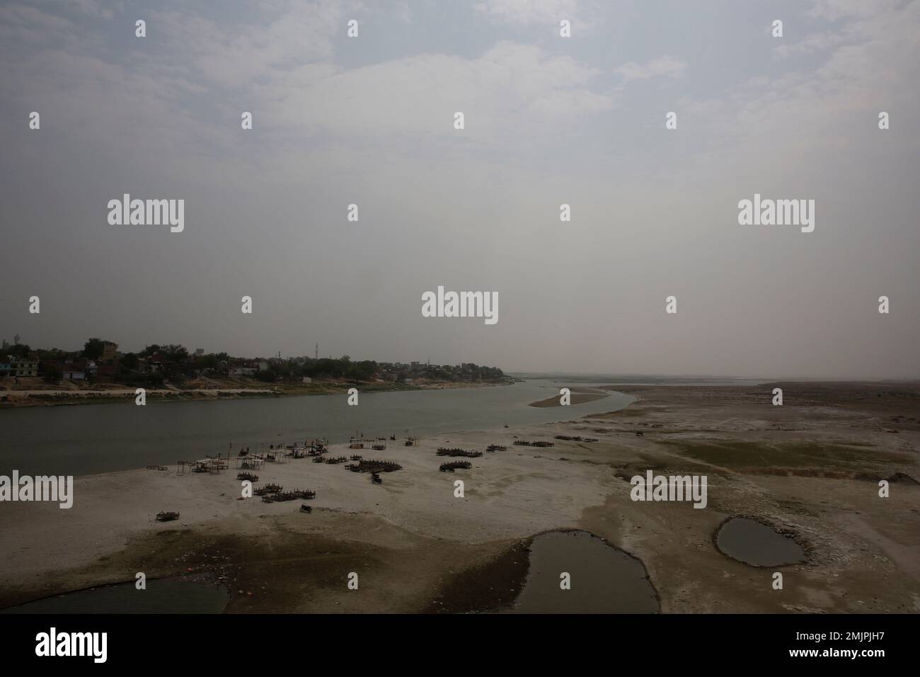 A partially dried up bed of the River Ganges is seen on the outskirts ...
