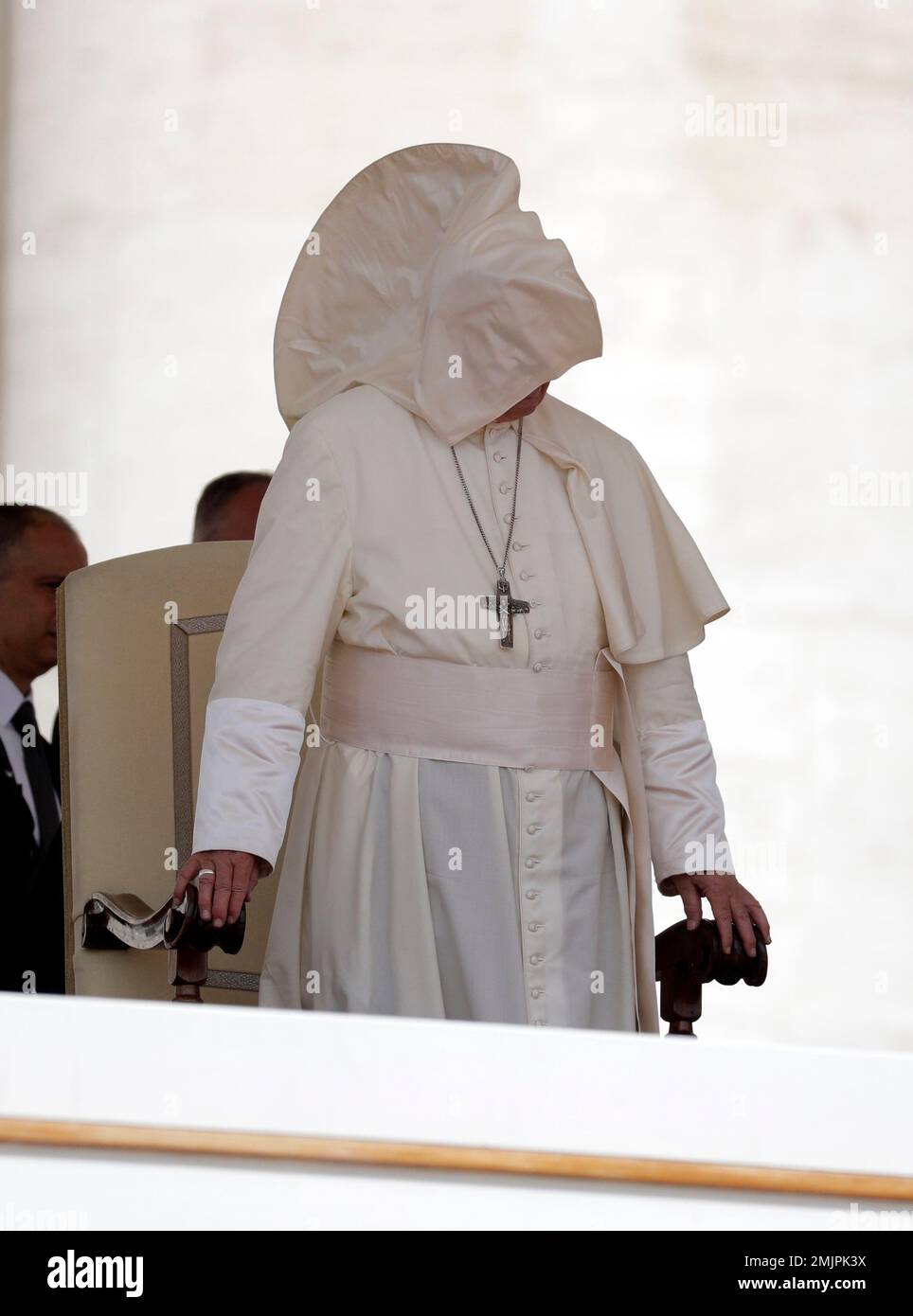 A gust of wind lifts Pope Francis' mantle during his weekly general ...