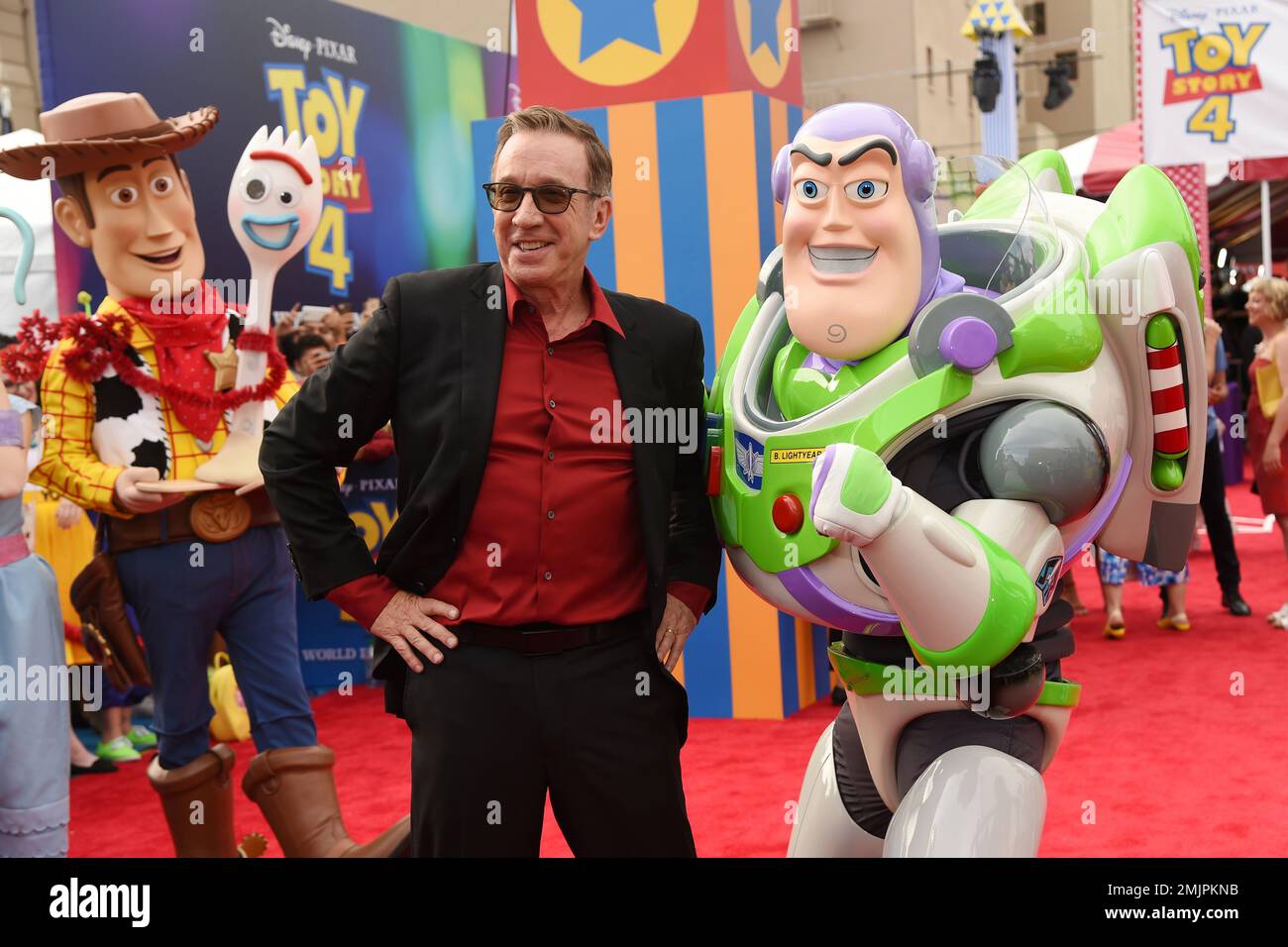 Voice cast member Tim Allen poses with his character Buzz Lightyear at ...