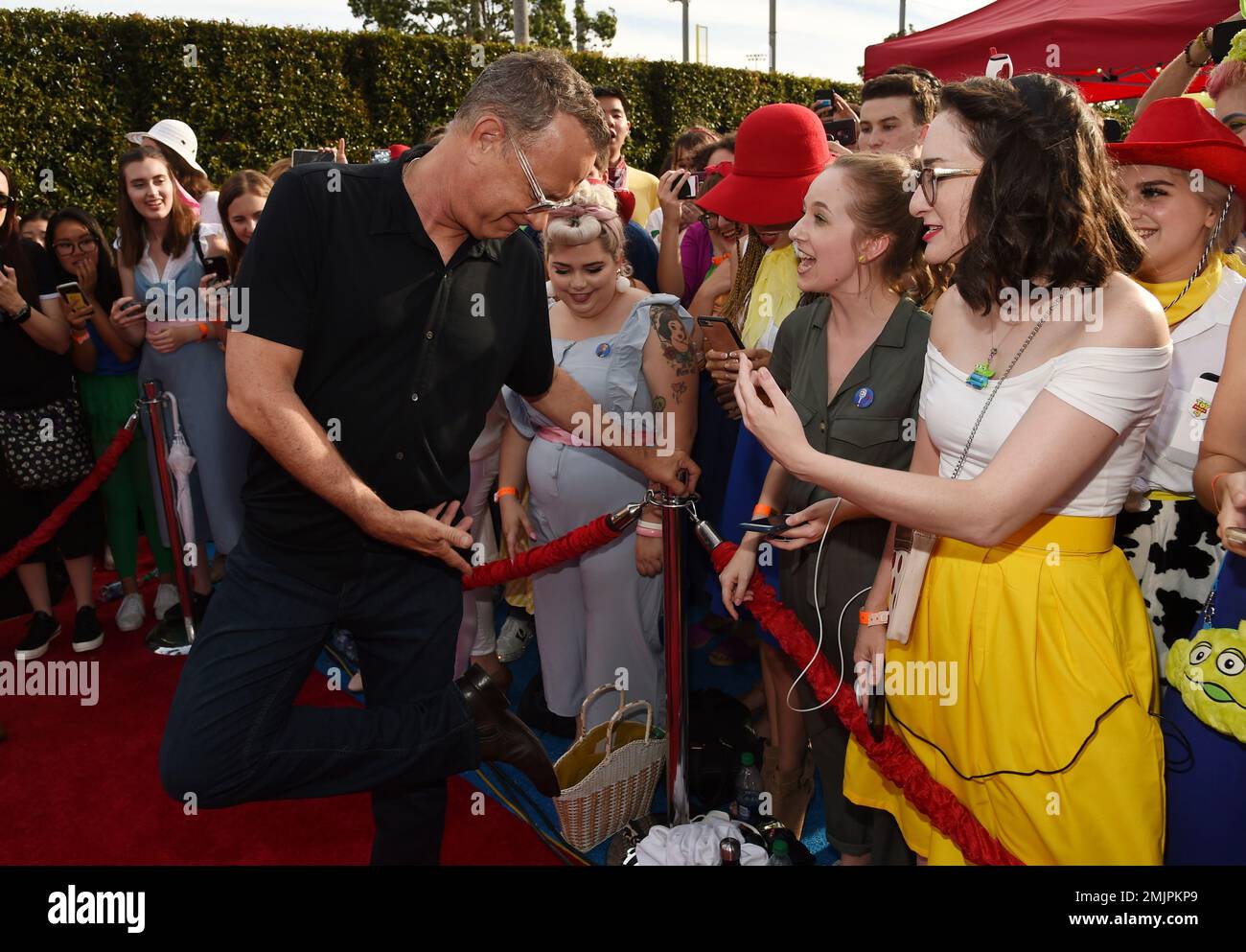 Tom Hanks, a voice cast member in "Toy Story 4," mingles with fans at ...