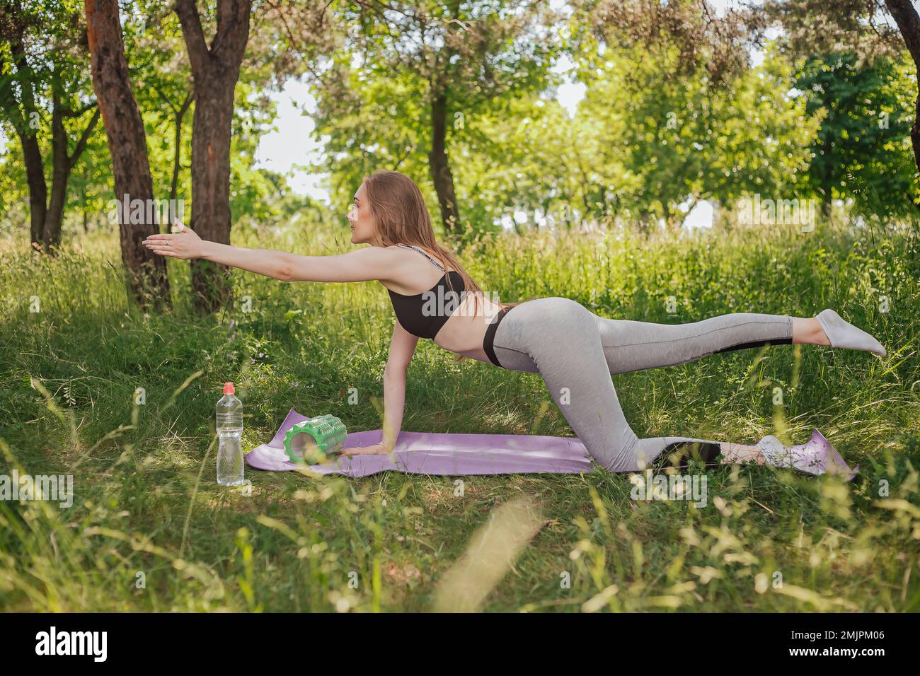 Woman exercise workout in gym fitness breaking relax holding apple ...