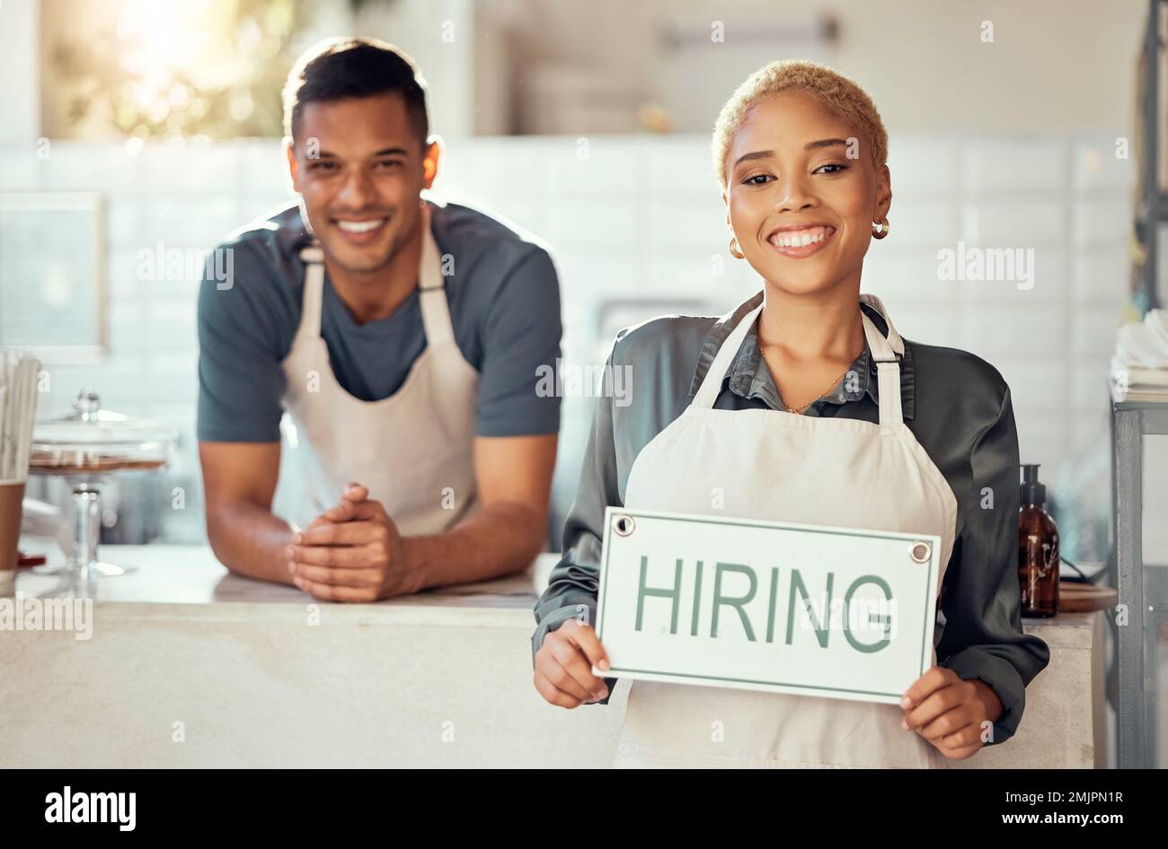Happy, partnership and hiring sign by small business owners at coffee ...