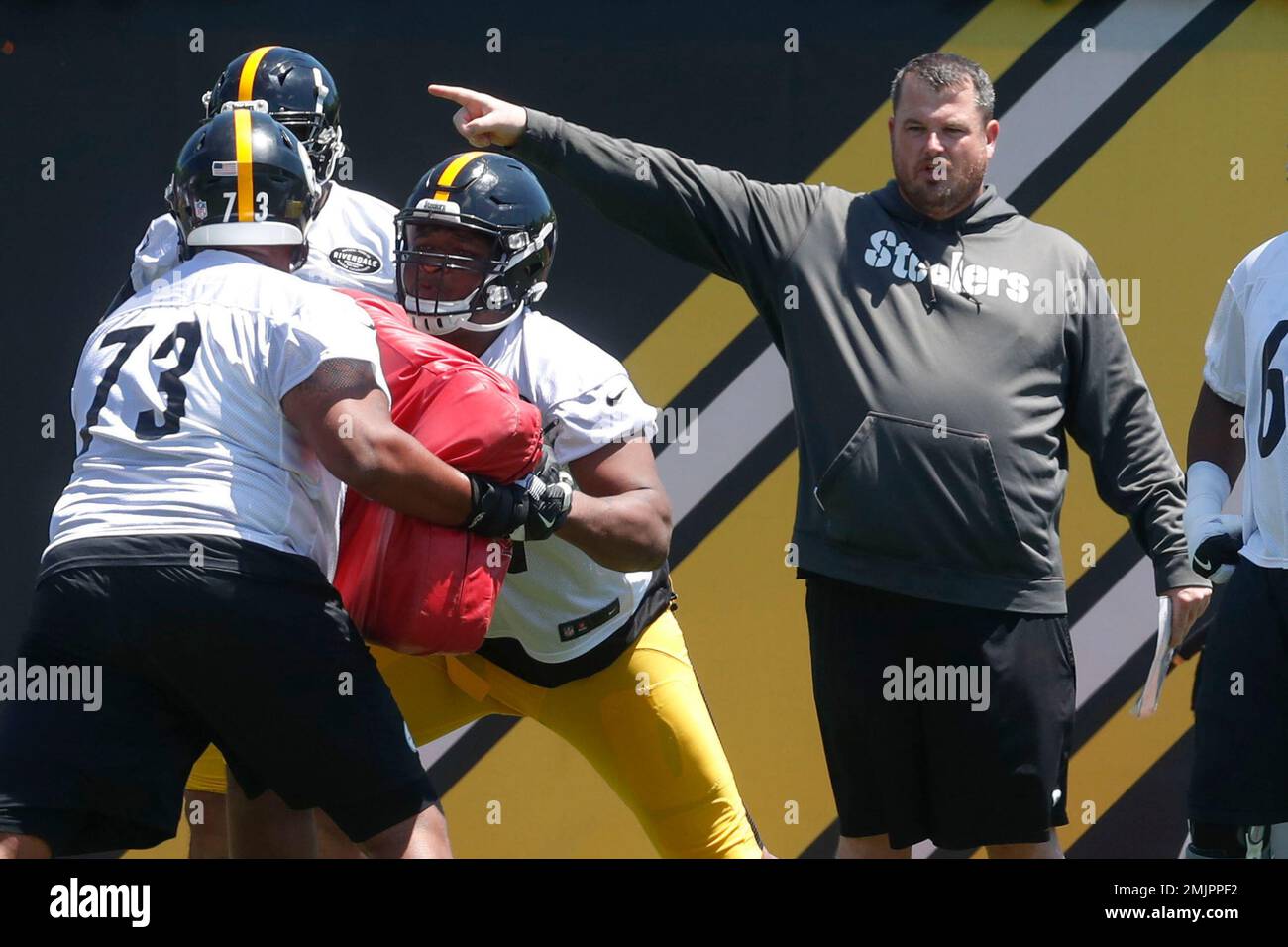 Pittsburgh Steelers offensive line coach Shaun Surratt, right, gives ...