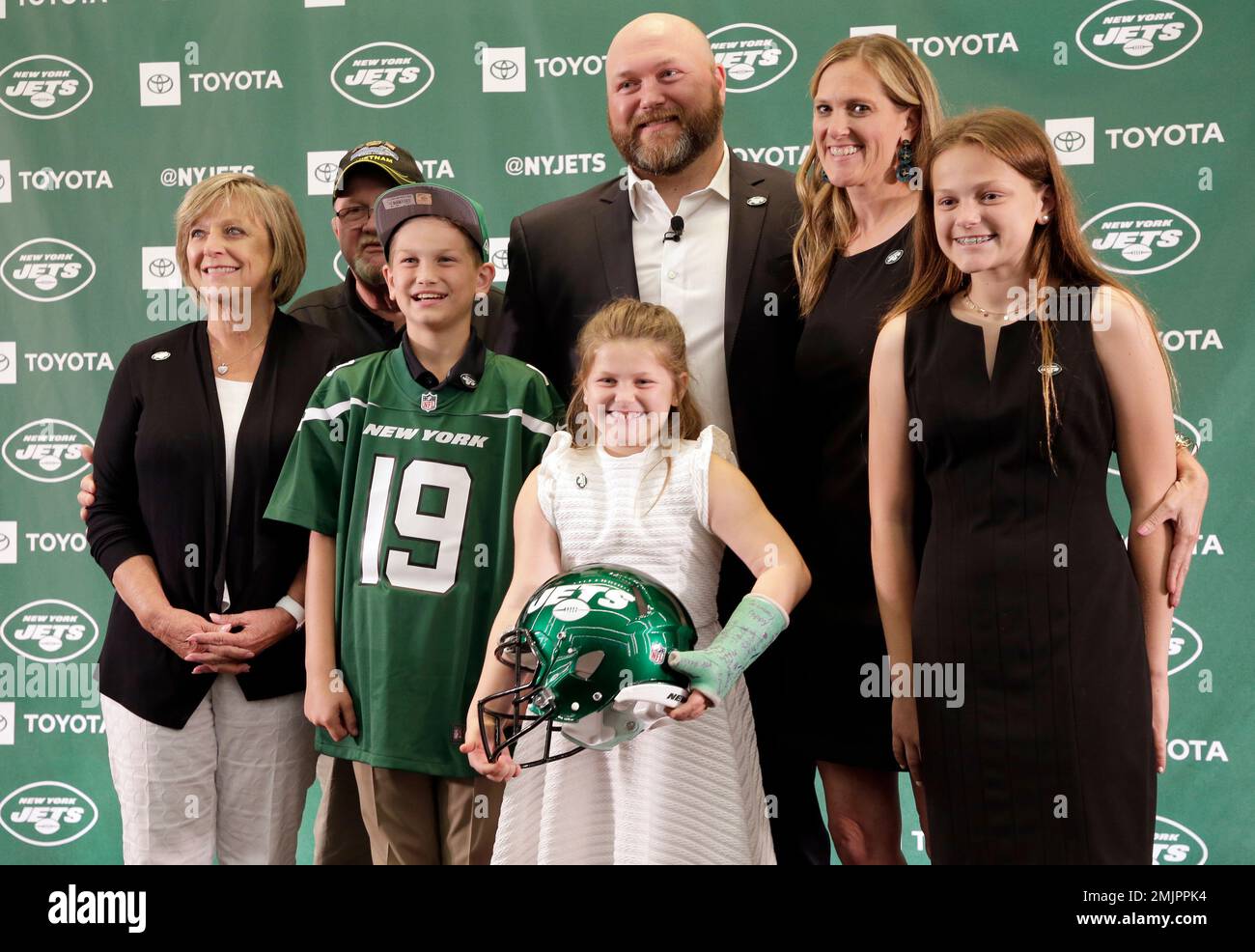 New York Jets general manager Joe Douglas, center, poses for a picture ...