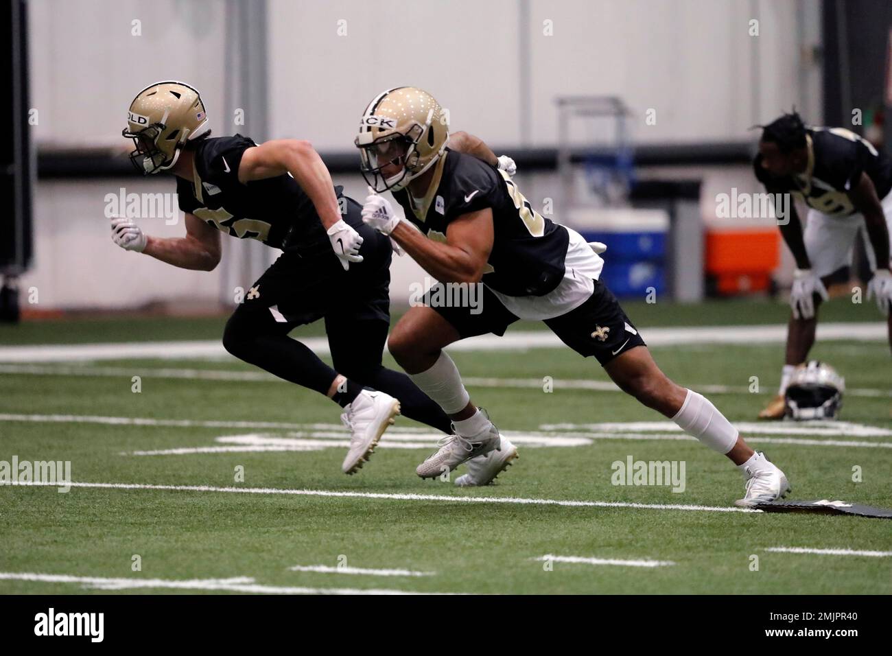 New Orleans Saints tight ends Dan Arnold and Alize Mack, right, run a ...