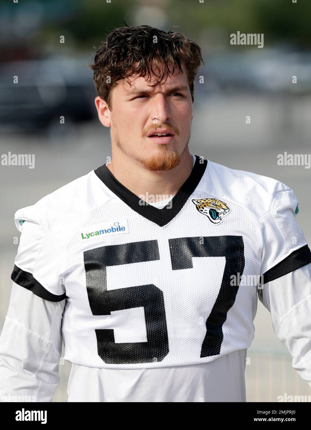 Jacksonville Jaguars linebacker Nick DeLuca walks to the field at an ...