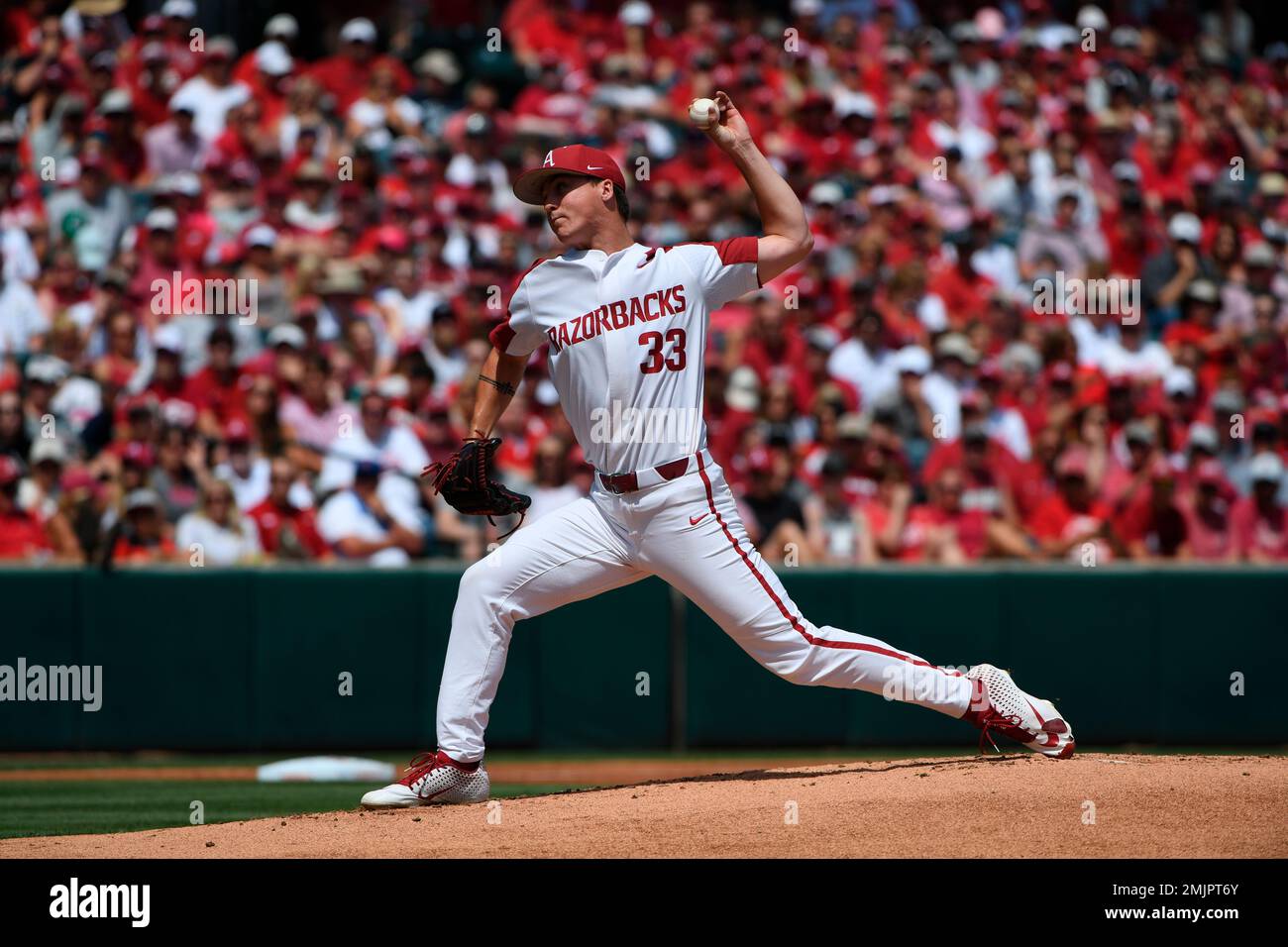 Arkansas pitcher Patrick Wicklander throws a pitch against Mississippi during Game 3 at the NCAA ...