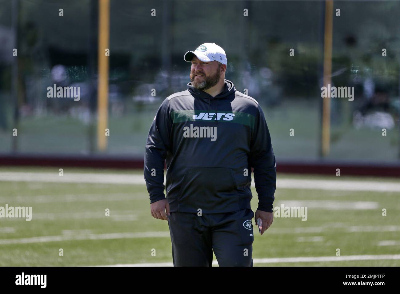 New York Jets general manager Joe Douglas arrives to greet reporters ...