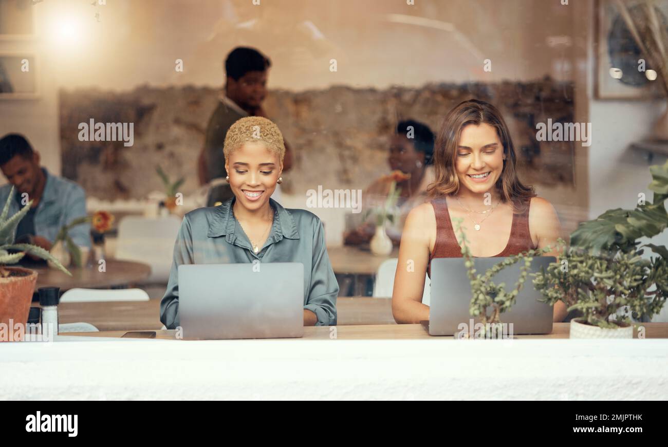Working, laptop and business women in cafe window for remote work, freelance career and research ...
