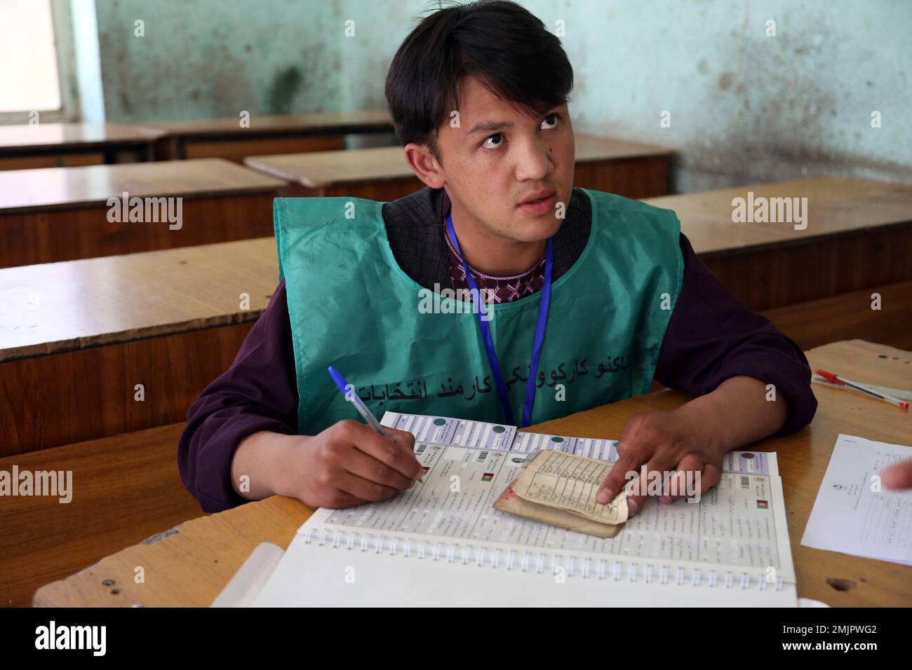 An Afghan employee of the Independent Election Commission (IEC ...