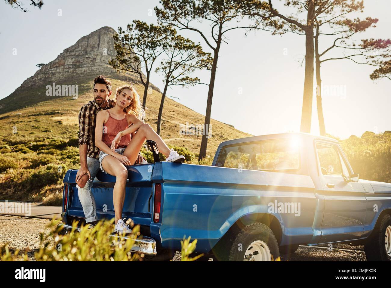 Road trips are always a good idea. an affectionate couple pulling over ...