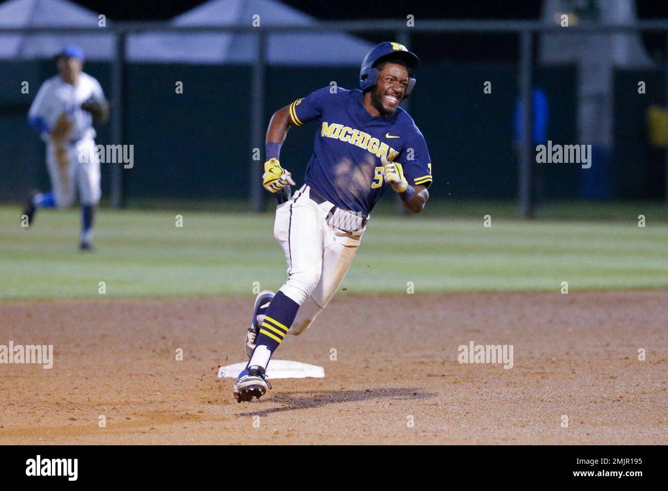 Michigan's Christan Bullock (5) runs past second base after he hitting ...