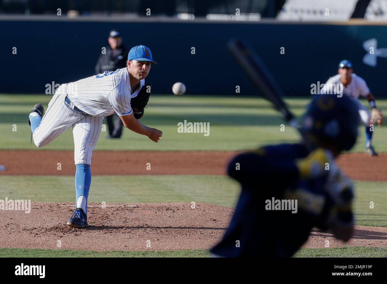 UCLA's Nick Nastrini (30) throws to a Michigan batter during an NCAA ...