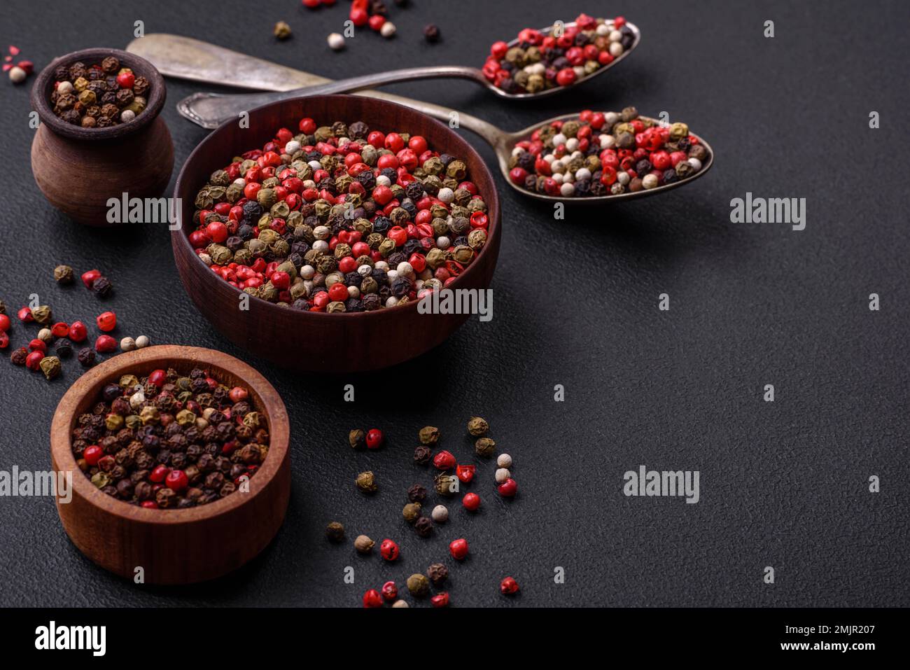 Spice allspice of different colors pink, white, green not ground in a ...
