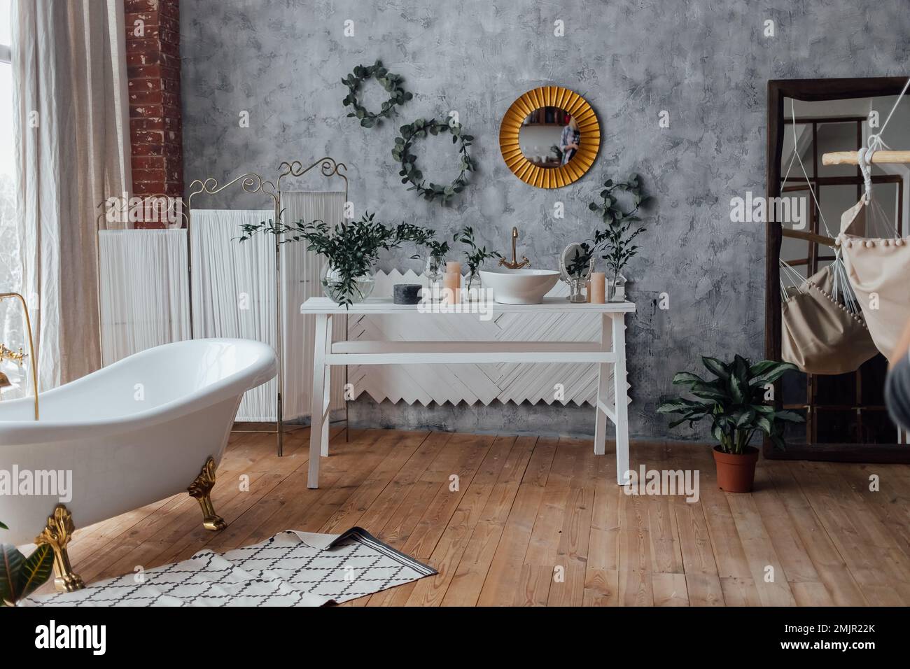 Cozy bathroom interior background with big white bathtub, natural green ...