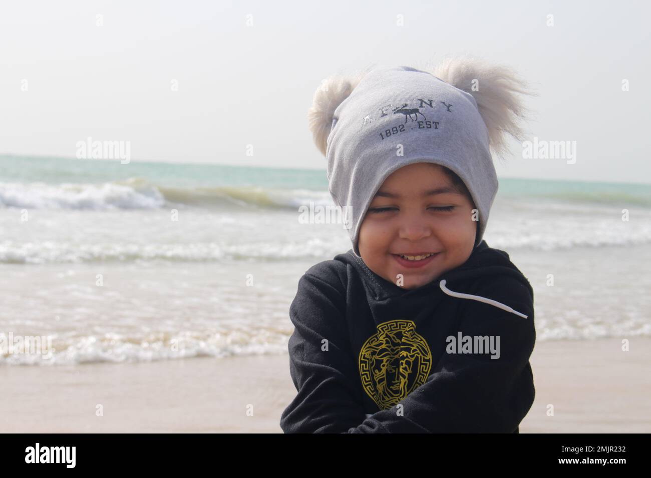 Boy laughing sea hi-res stock photography and images - Alamy