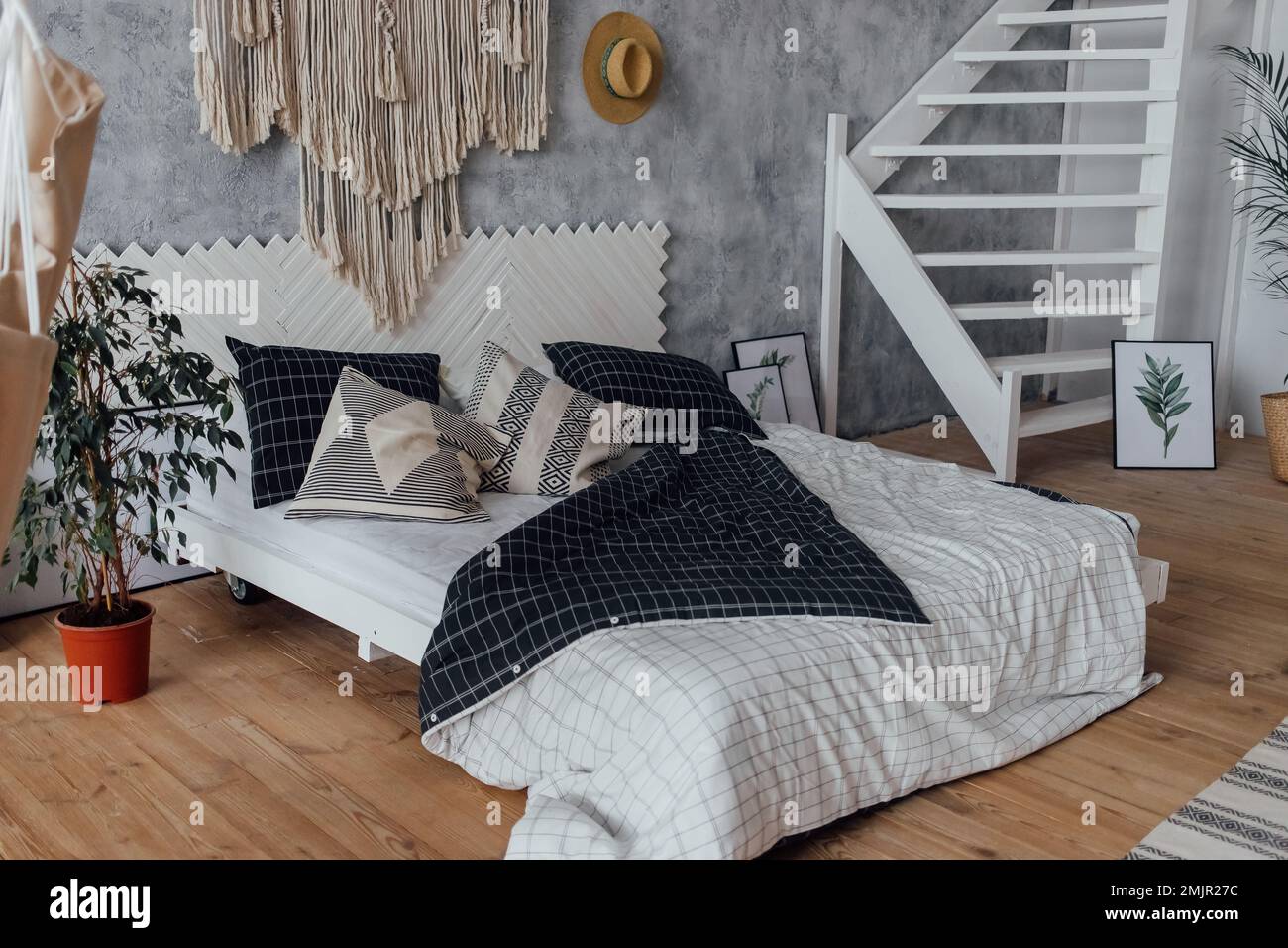 Big comfortable bed with clean linen in room Stock Photo - Alamy