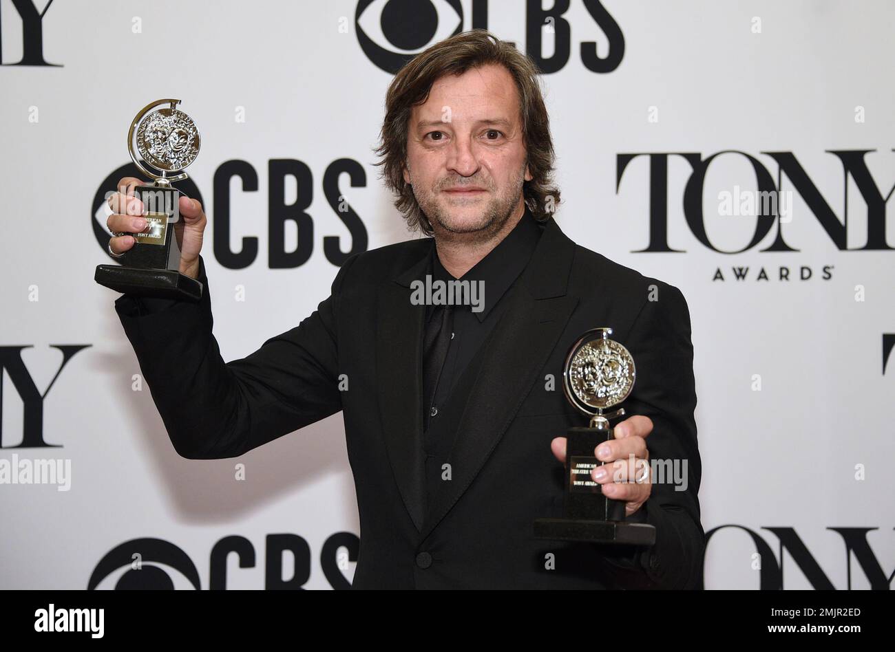 Rob Howell poses in the press room with the award for the best costume ...