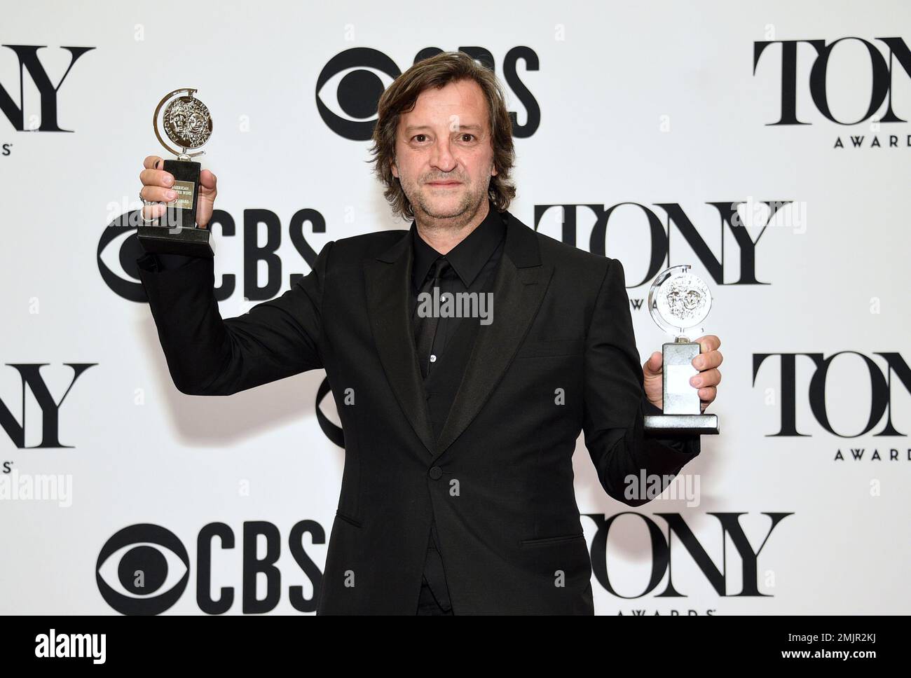 Rob Howell poses with the award for the best costume design of a play ...