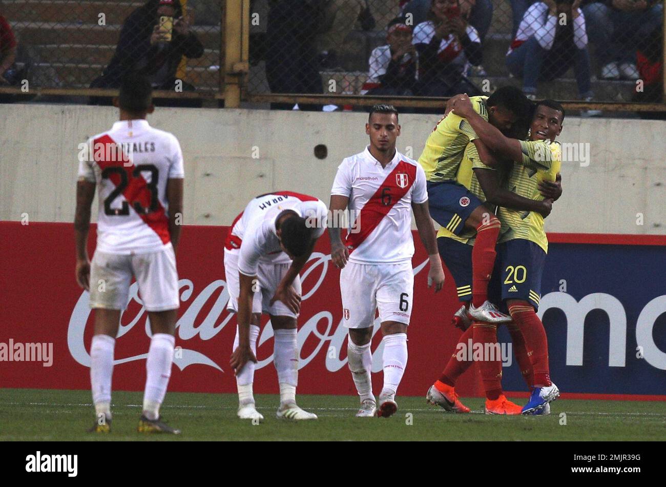 Colombia's players, right, celebrate their third goal against Peru ...
