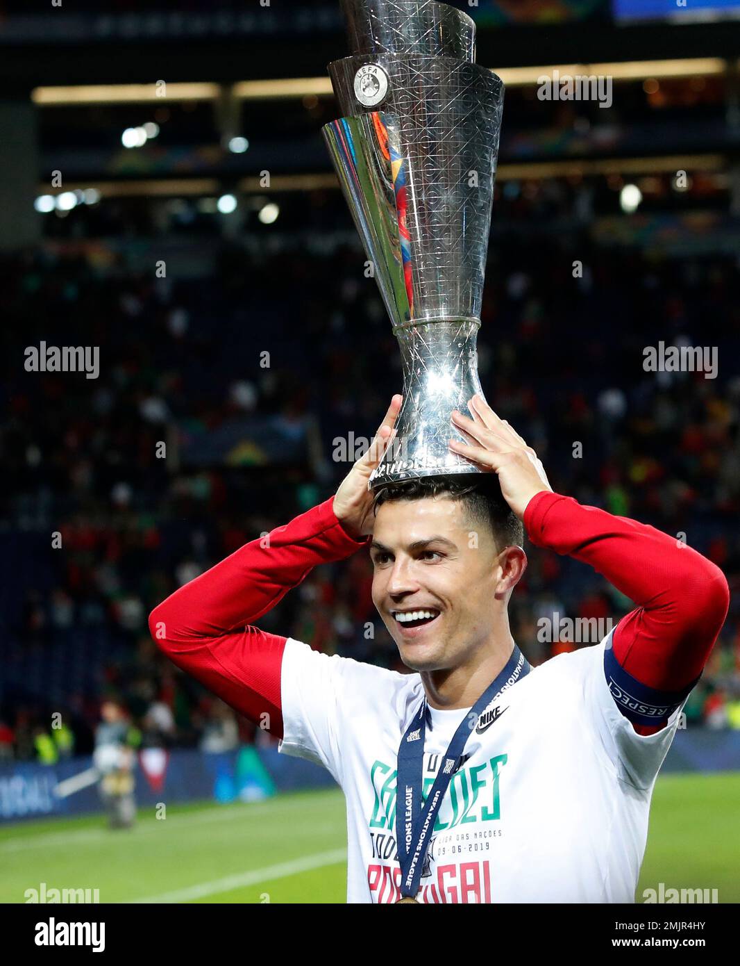 Portugal's Cristiano Ronaldo holds the trophy on his head as he ...