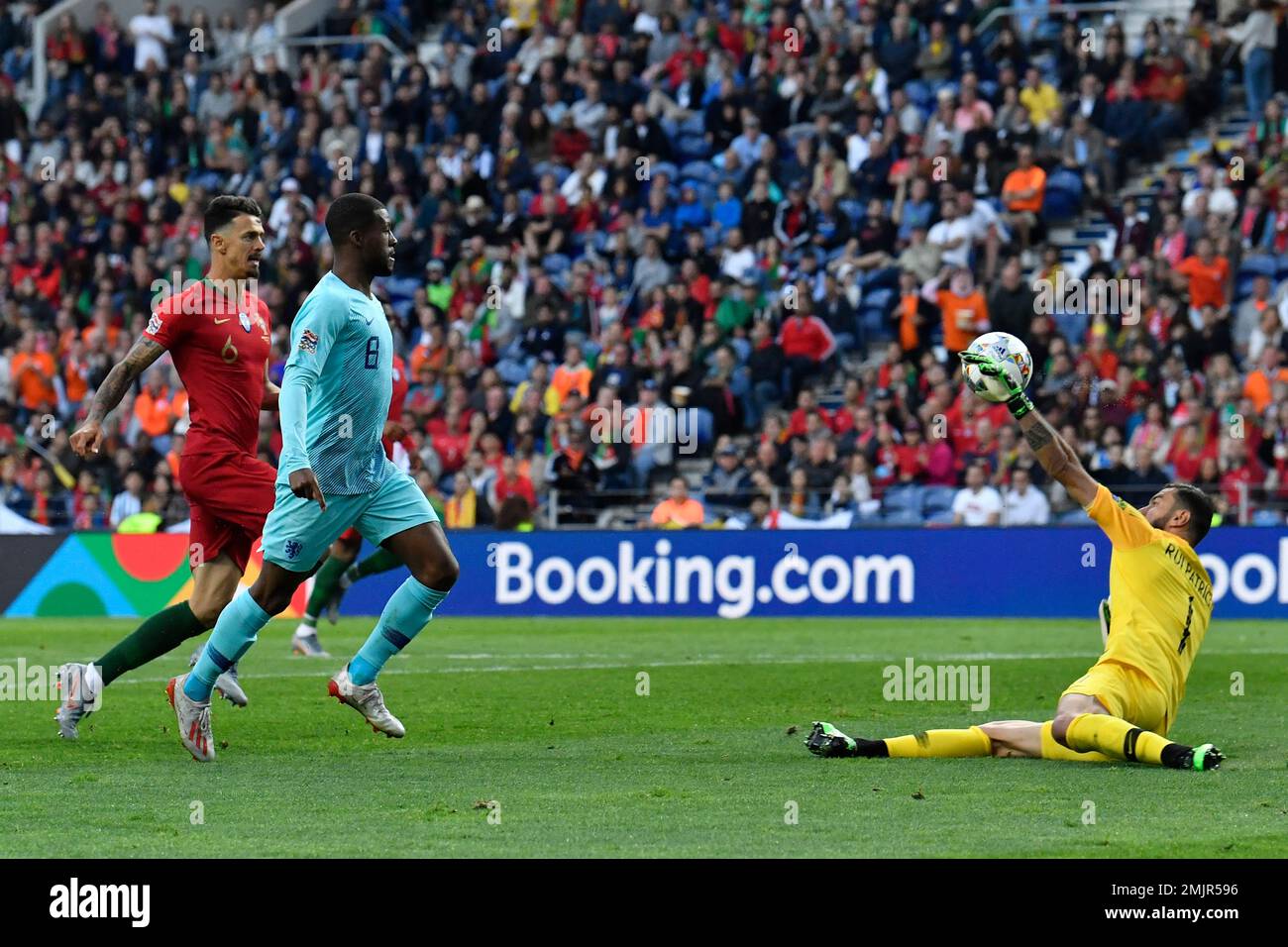 Portugal goalkeeper Rui Patricio, right, makes a save in front ...