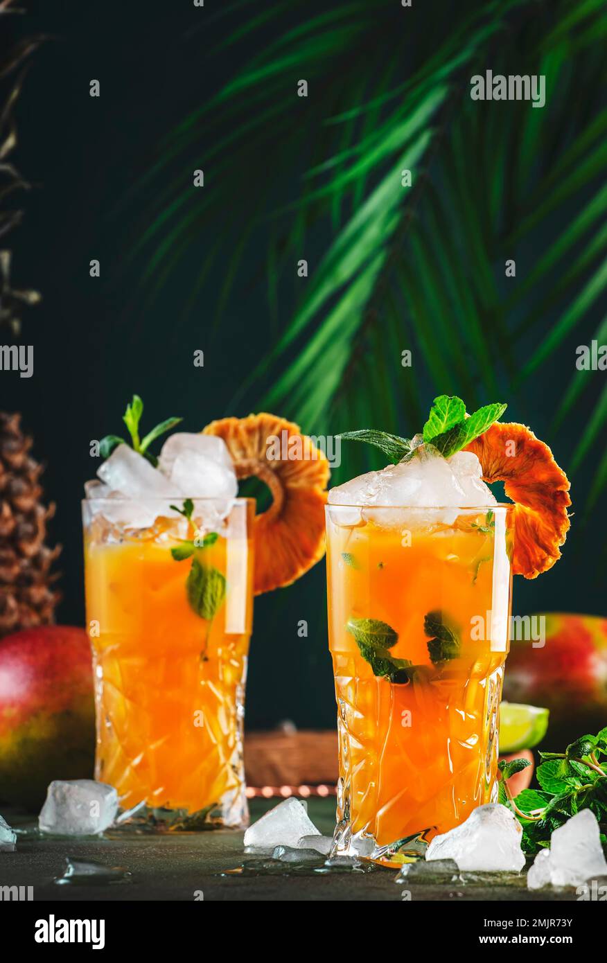 Alcoholic cocktail with vodka, pineapple juice, mango, liquor, ice ...