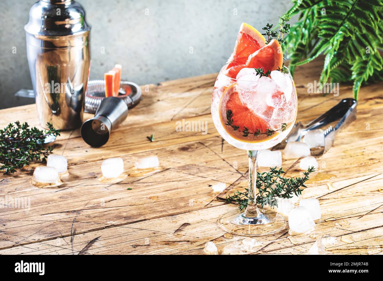 Gin bitter grapefruit cocktail drink with dry gin, tonic, thyme and ice ...