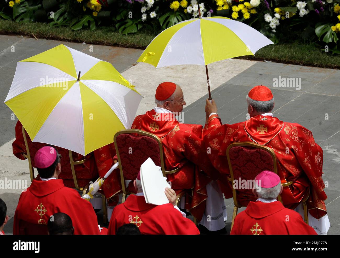 Cardinals shelter from the sun during a Pentecost Mass celebrated by ...