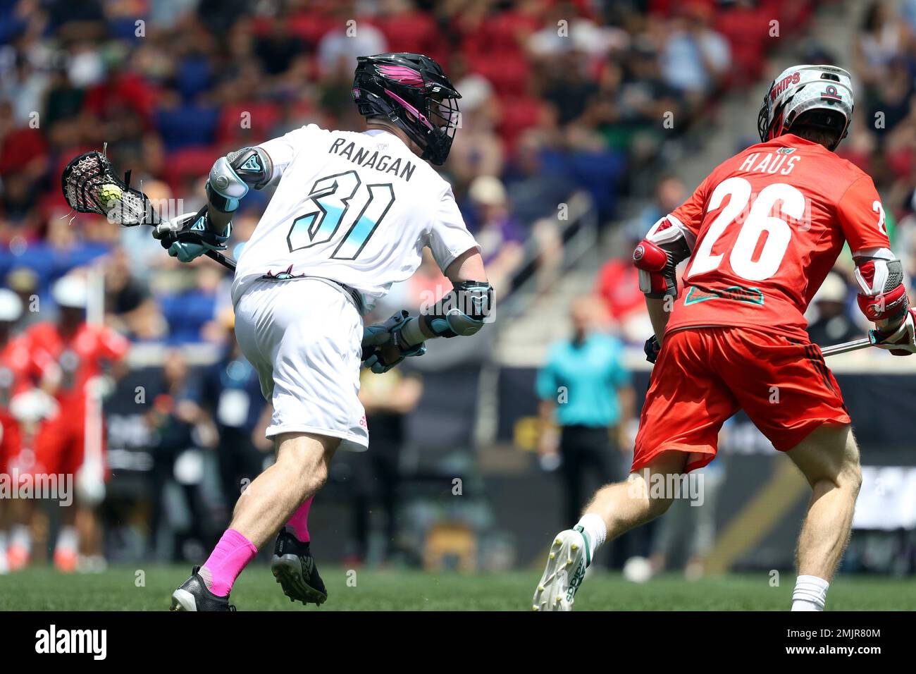 Chrome's John Ranagan carries the ball as Whipsnakes' John Haus pursues ...