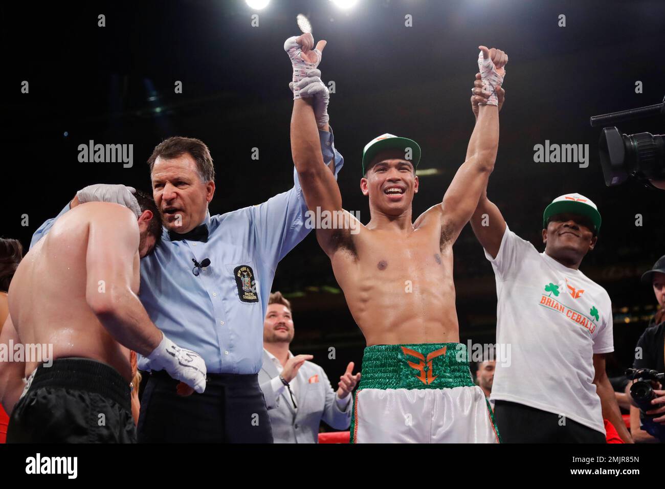 The referee consoles Bakhtiyar Eyubov, left, as Brian Ceballo ...