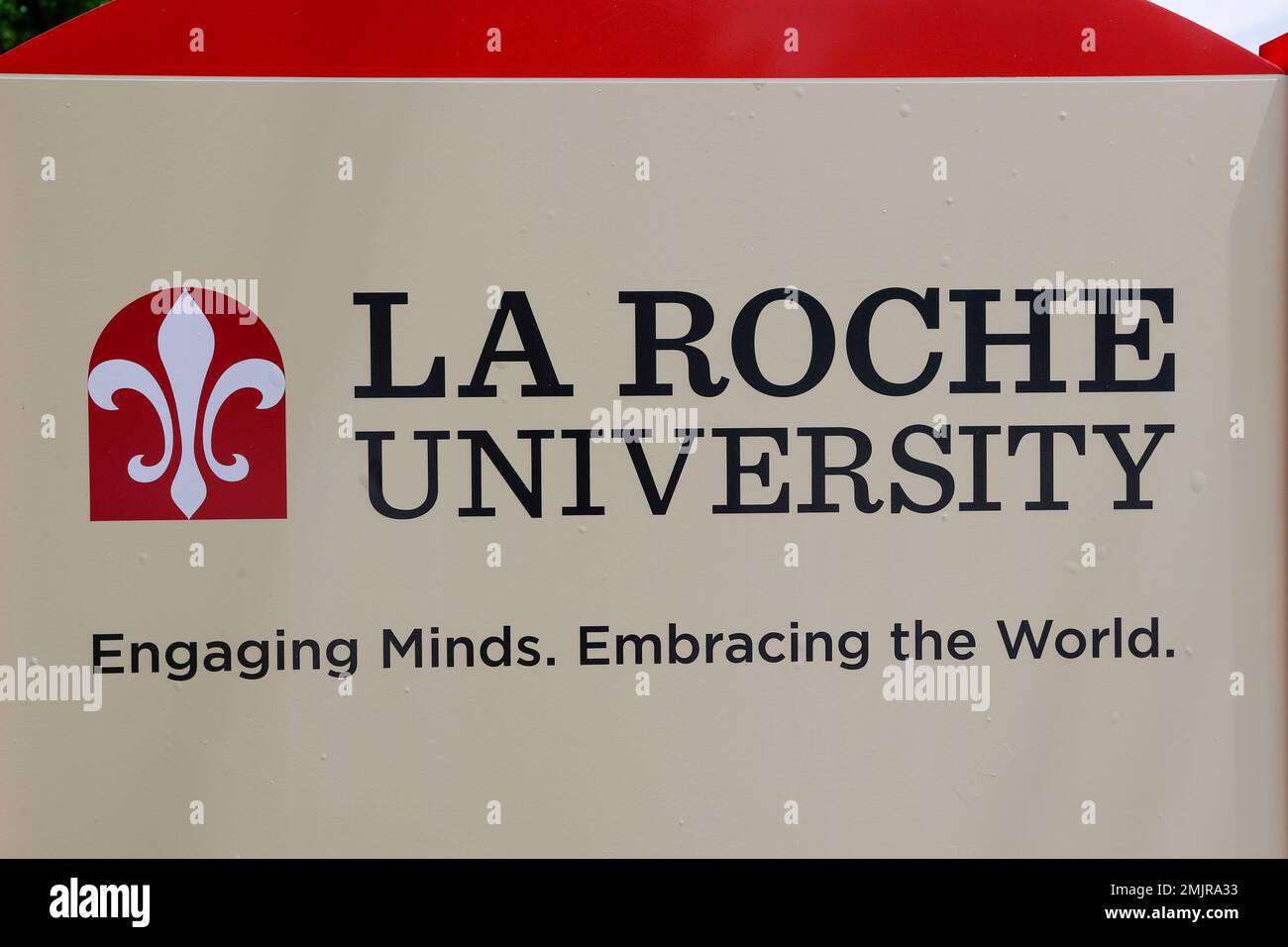 Signs for La Roche University are seen at the driveway to the campus ...