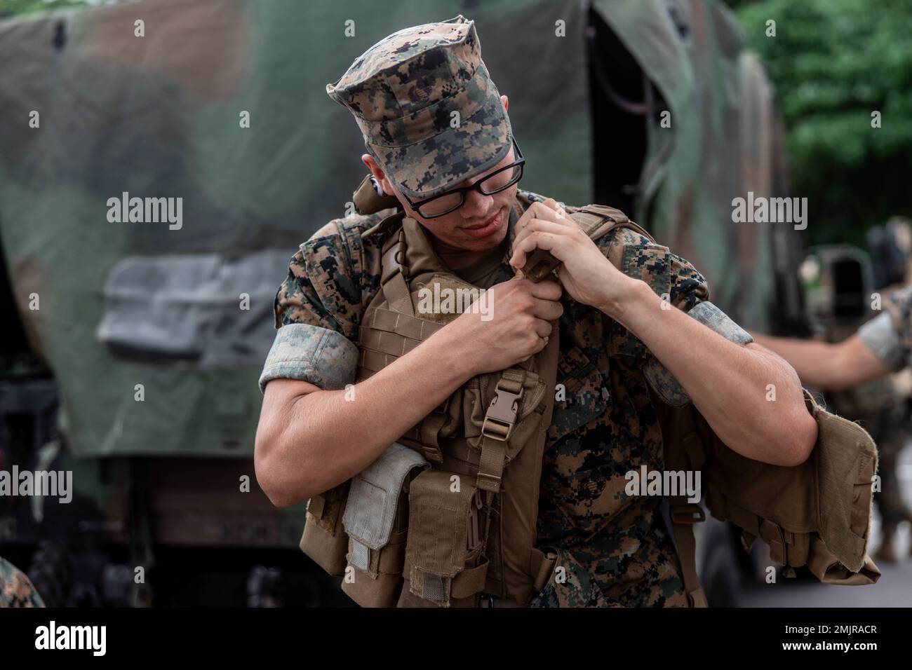 U.S. Marine Corps Pfc. John Harvey, an automotive maintenance ...