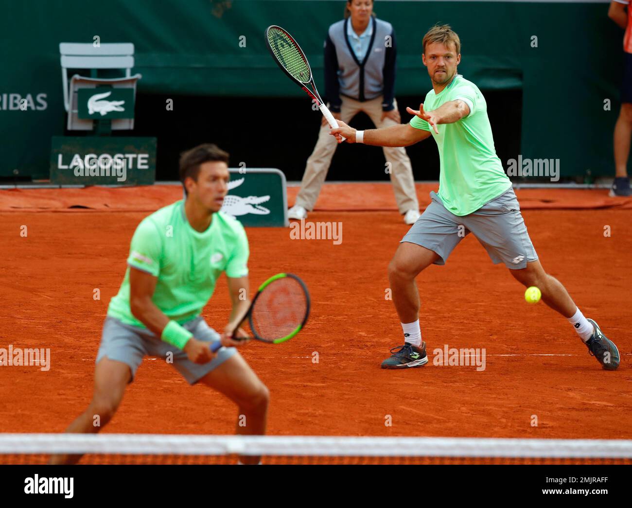 Germany's Kevin Krawietz, right, and Andreas Mies play a shot against ...