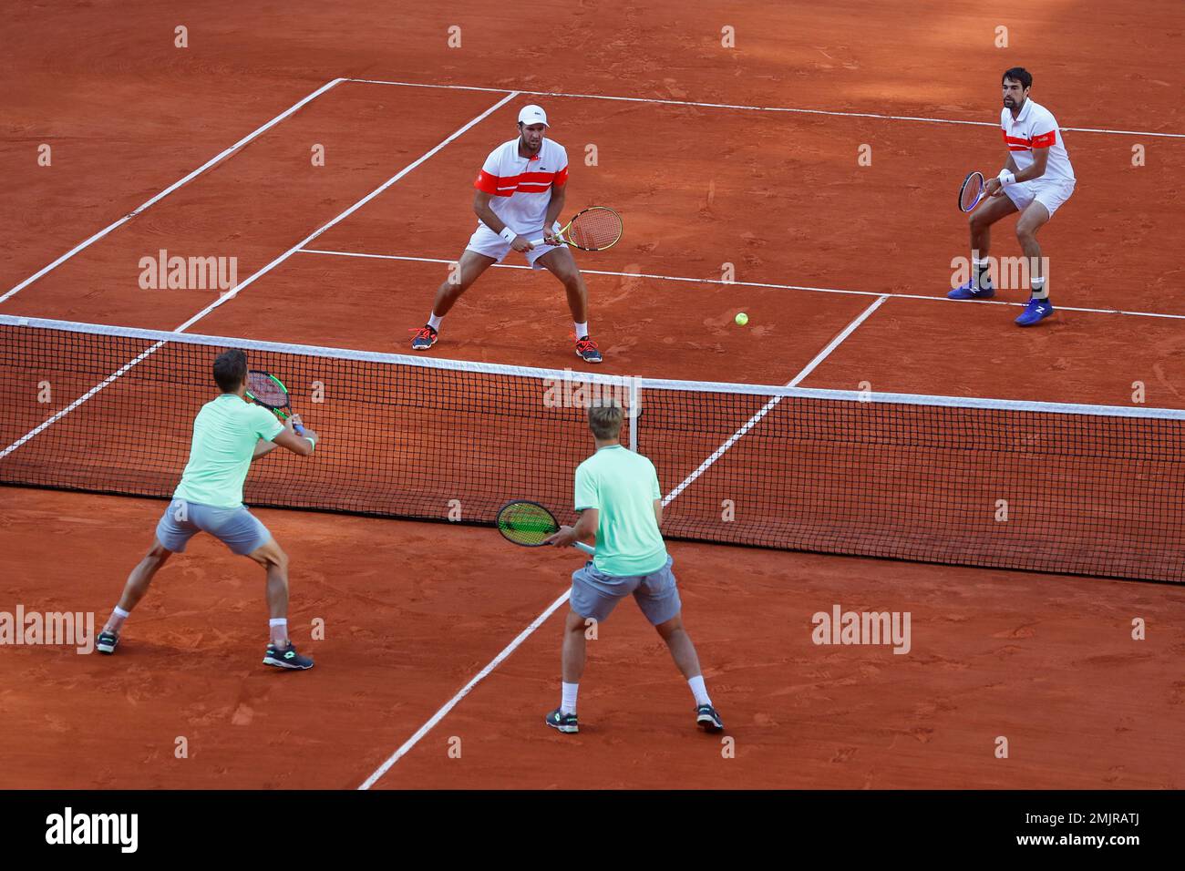 Germany's Kevin Krawietz, bottom right, and Andreas Mies play a shot ...