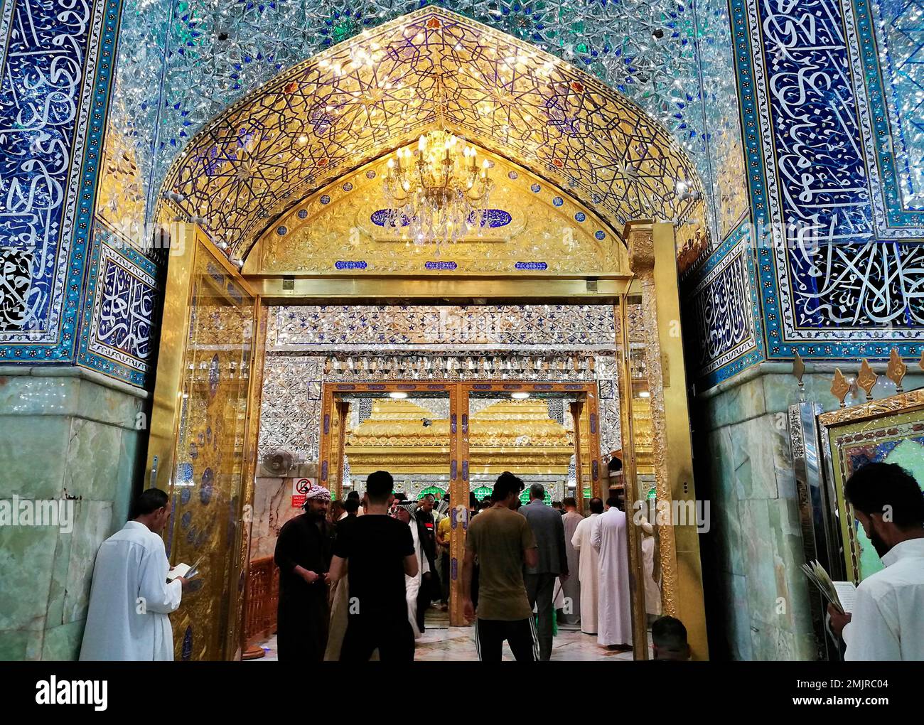 Shiite Muslim worshippers pray inside the holy shrine of Imam Ali, the ...